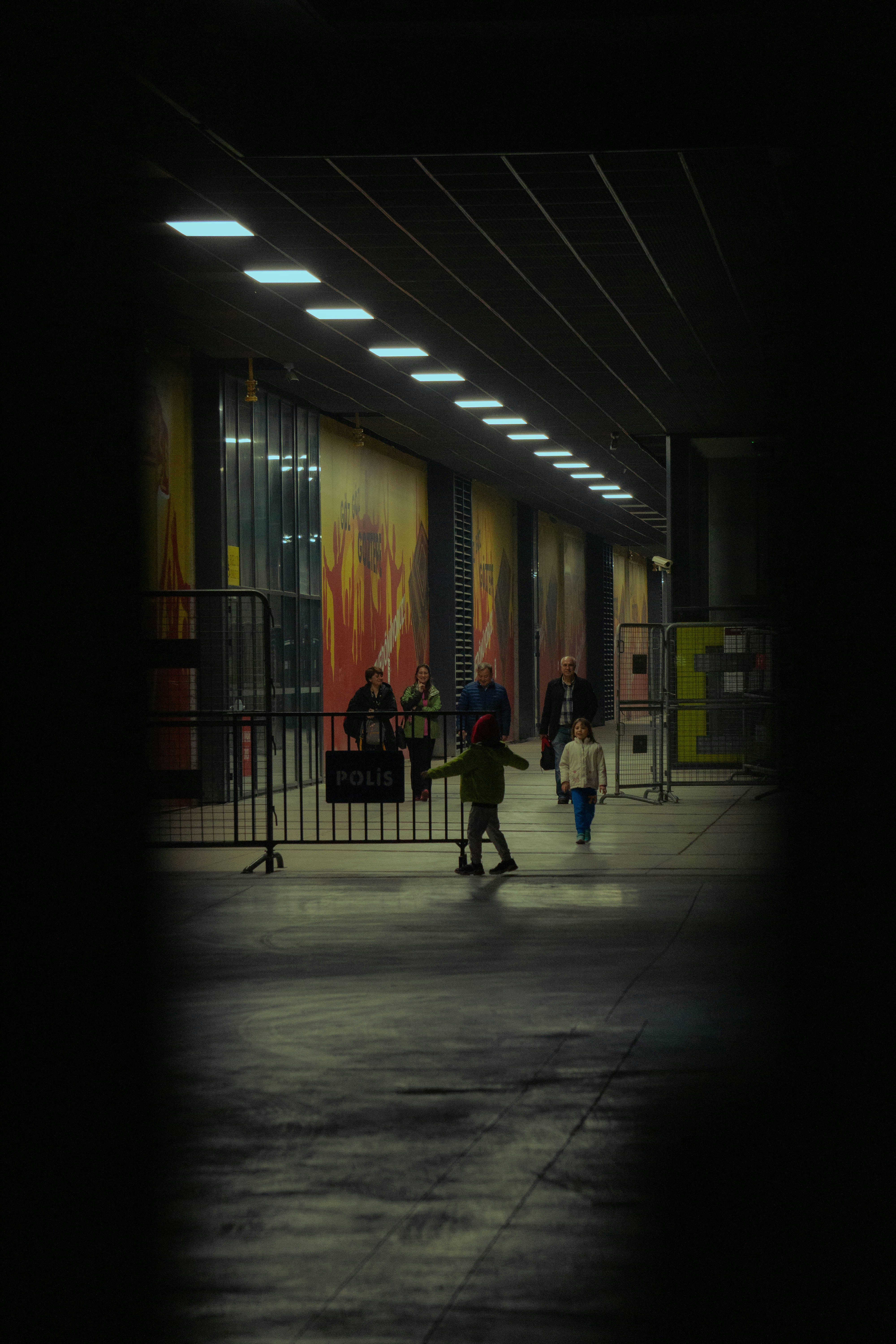 a group of people walking down a hallway