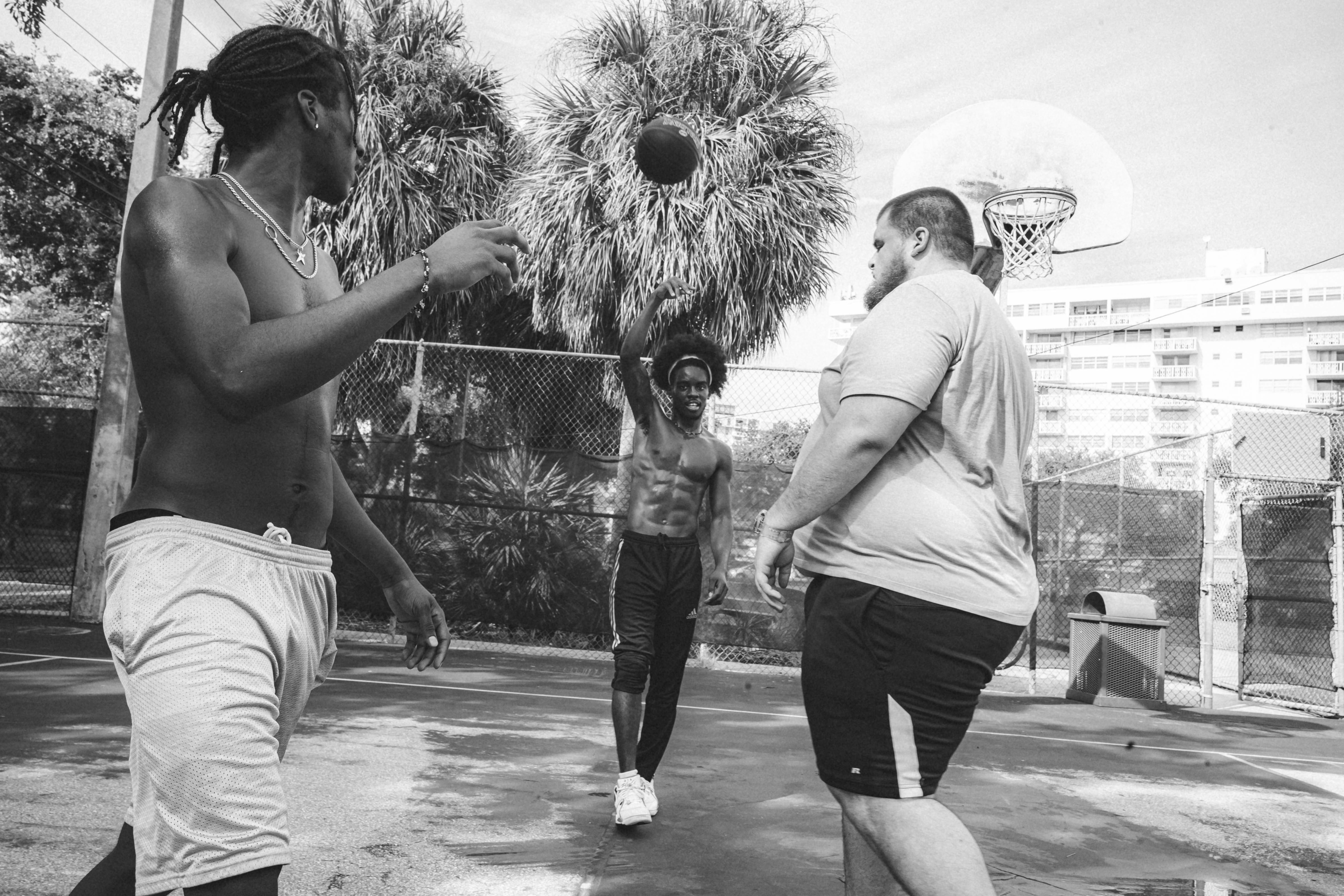 Midair on the Rooftop Court: A Black-and-White Basketball Moment