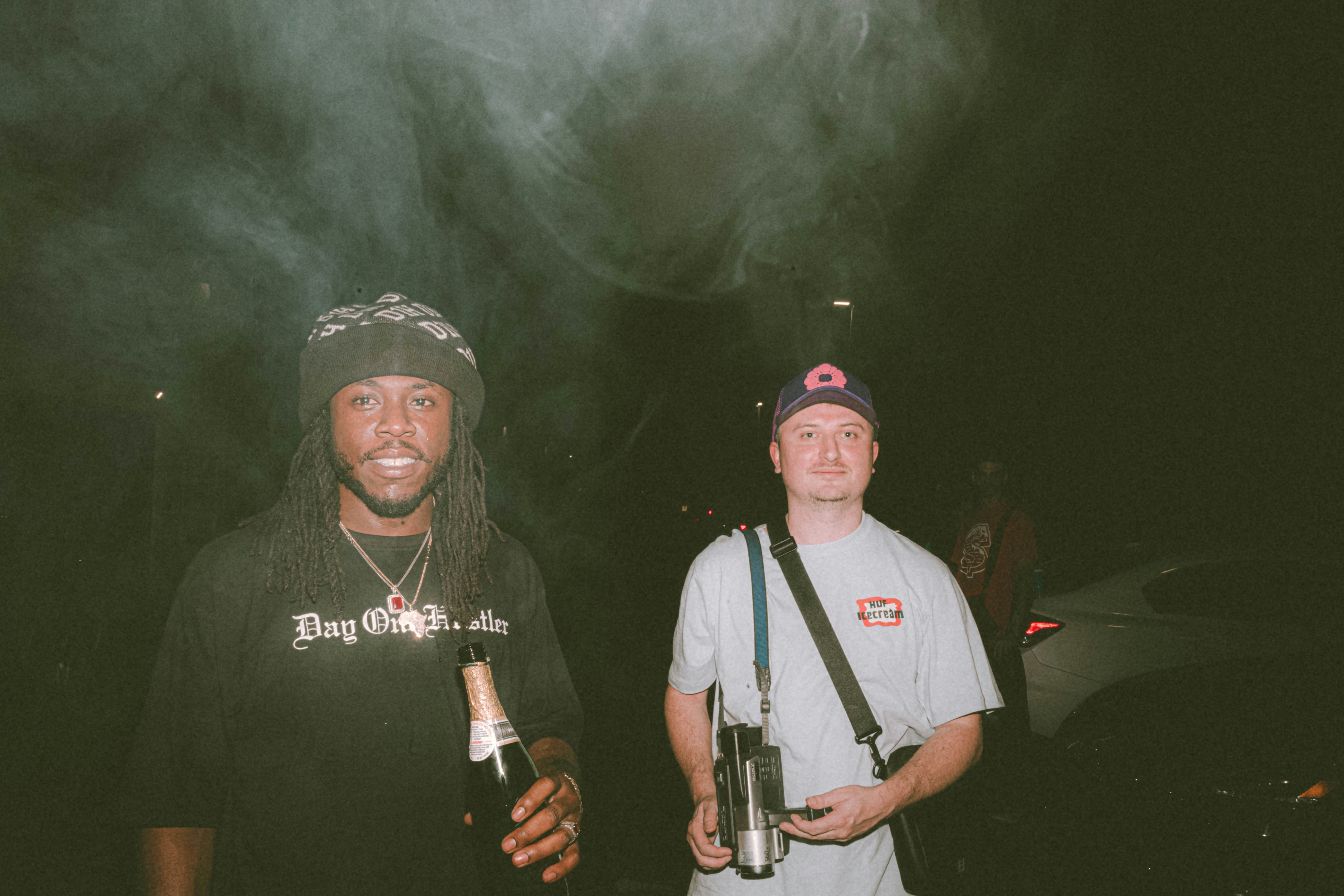 Hazy Night Duo: Quiet Confidence Under a Smoky Streetlight