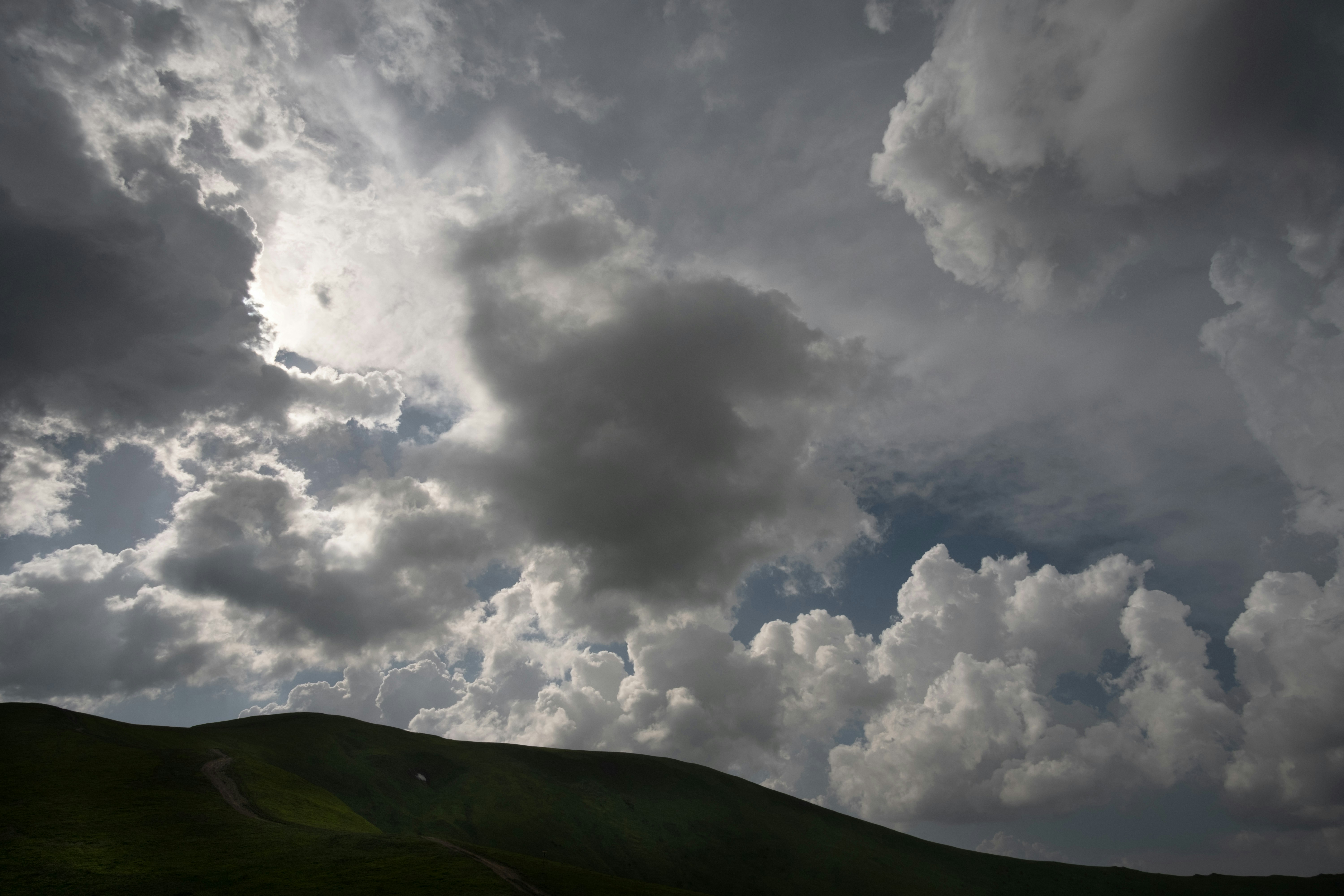 Whispers of a Storm Over Verdant Hills