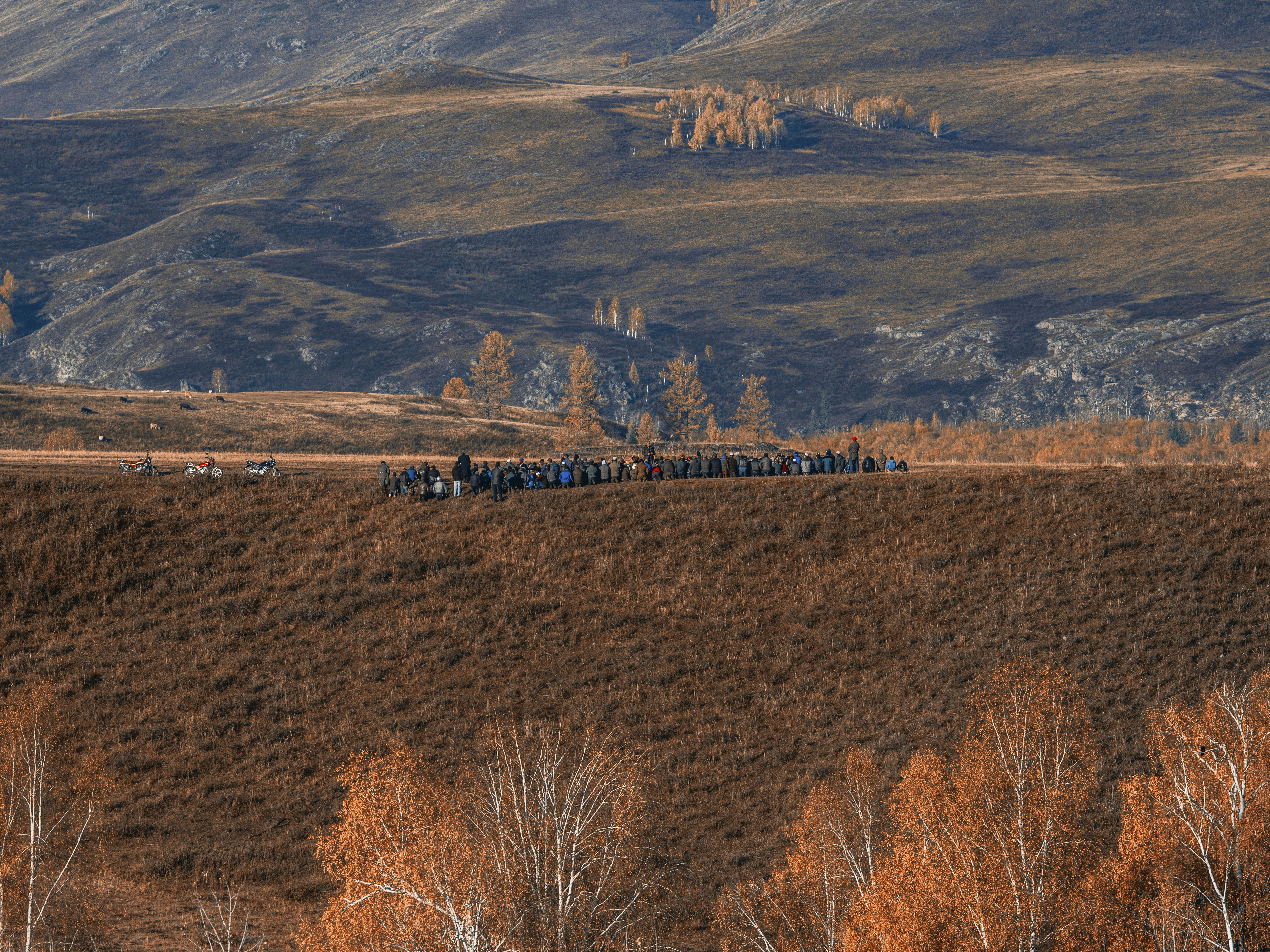 A group of people riding a train on a train track photo – Free Land ...