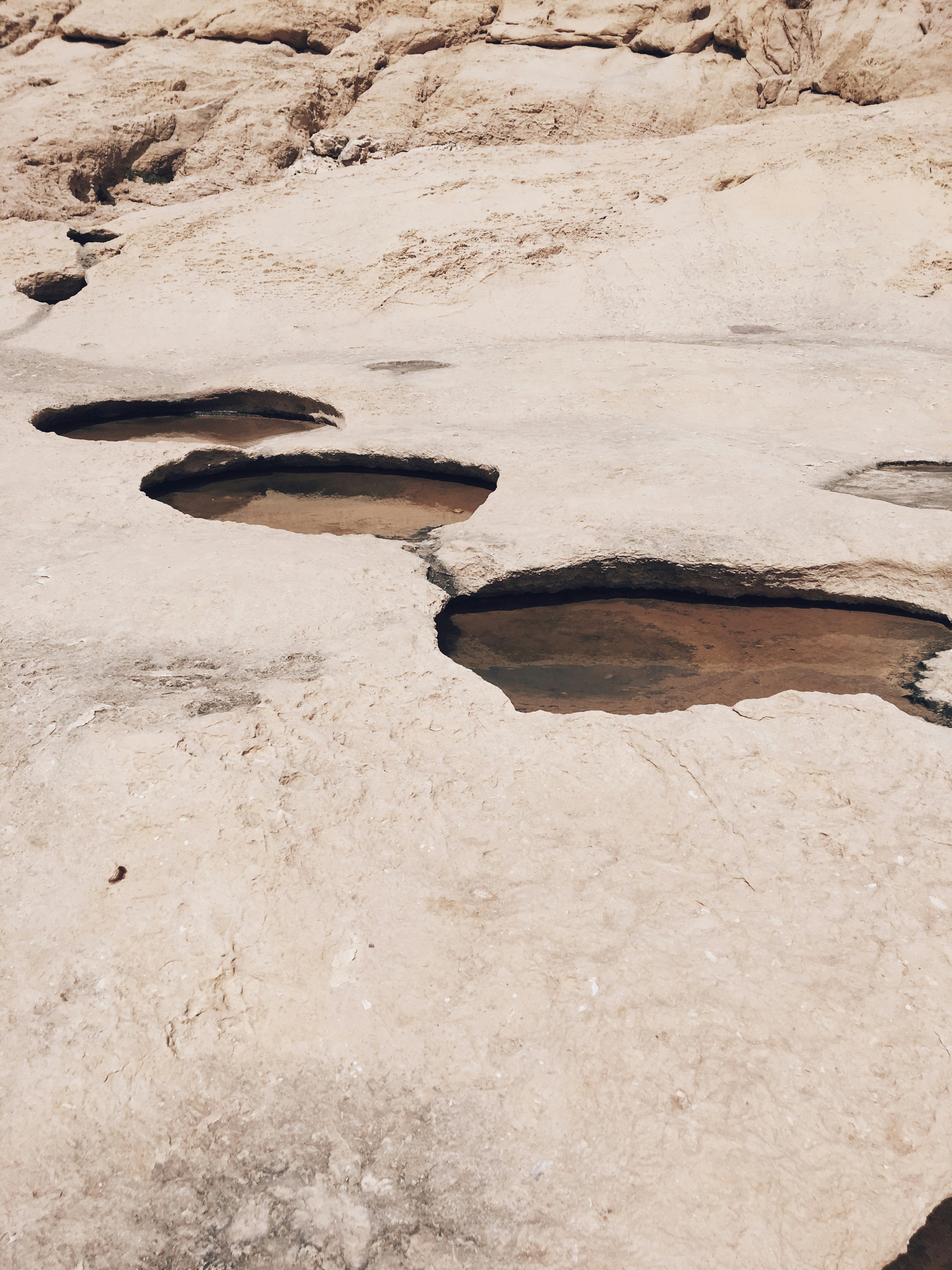 A group of rocks with holes in them photo – Free Gozo Image on Unsplash