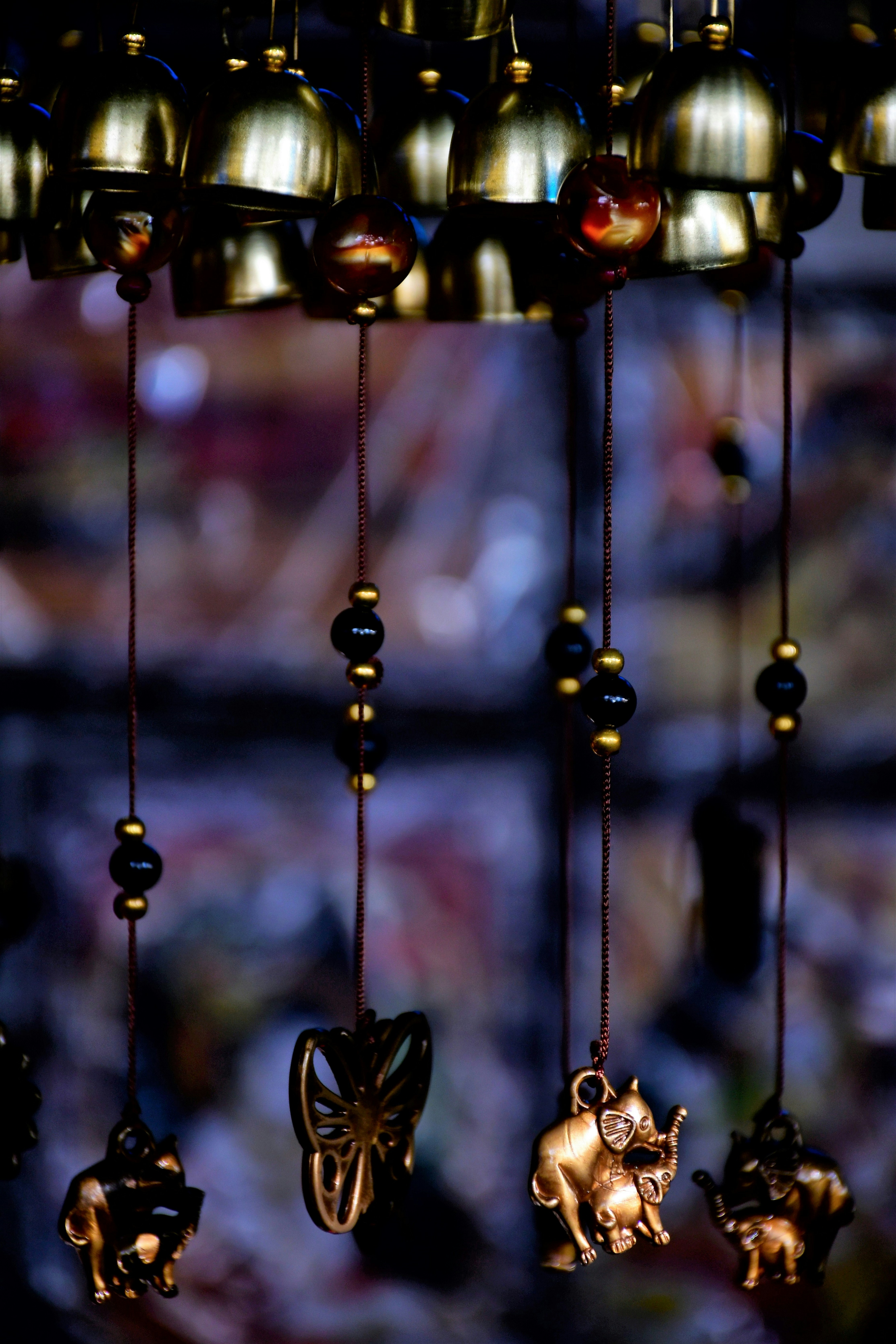 A group of bells hanging from a ceiling photo – Free Chandelier Image ...