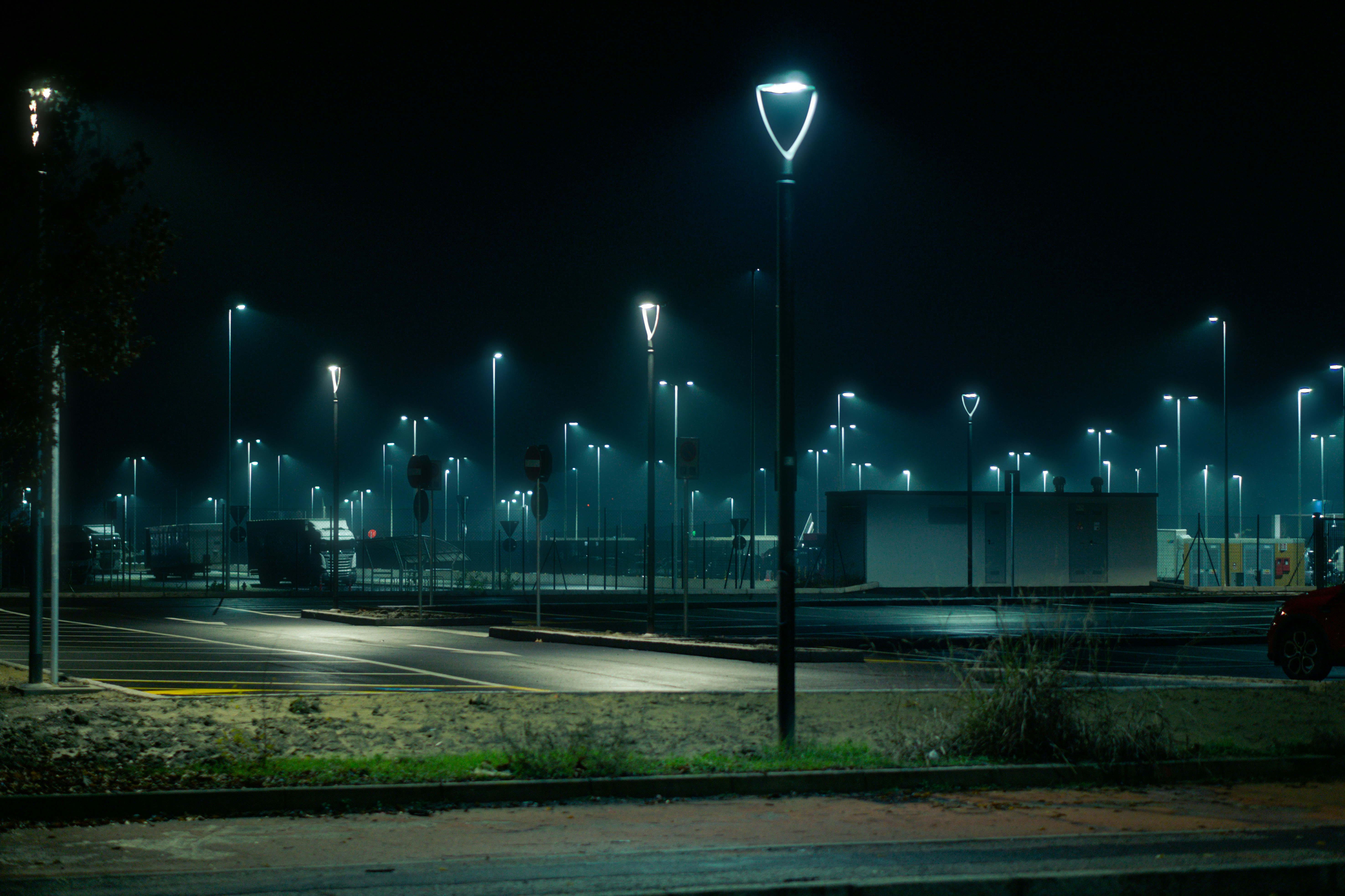 A street at night with a lot of street lights photo – Free Bologna ...