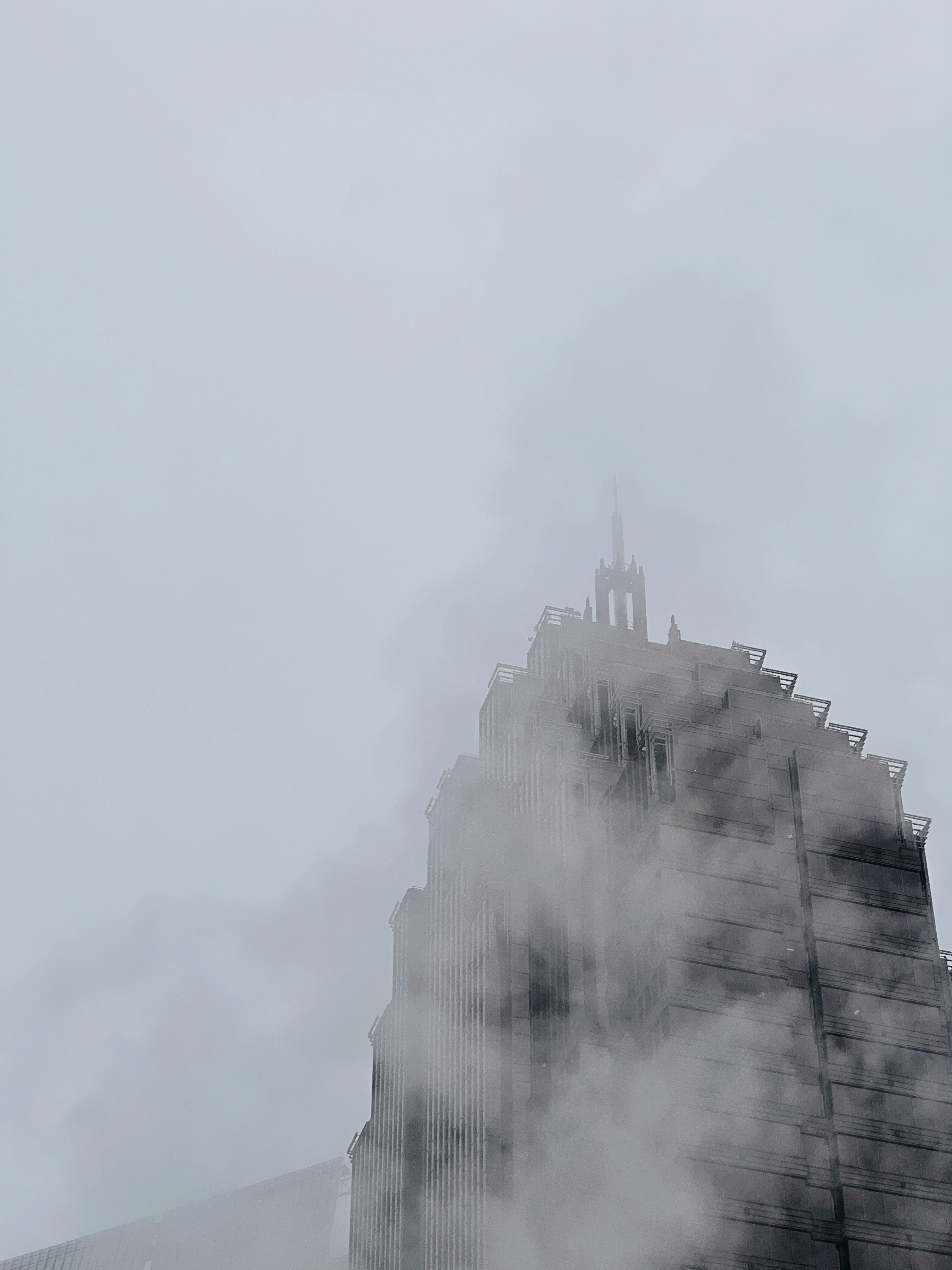 a tall building with steam coming out of it