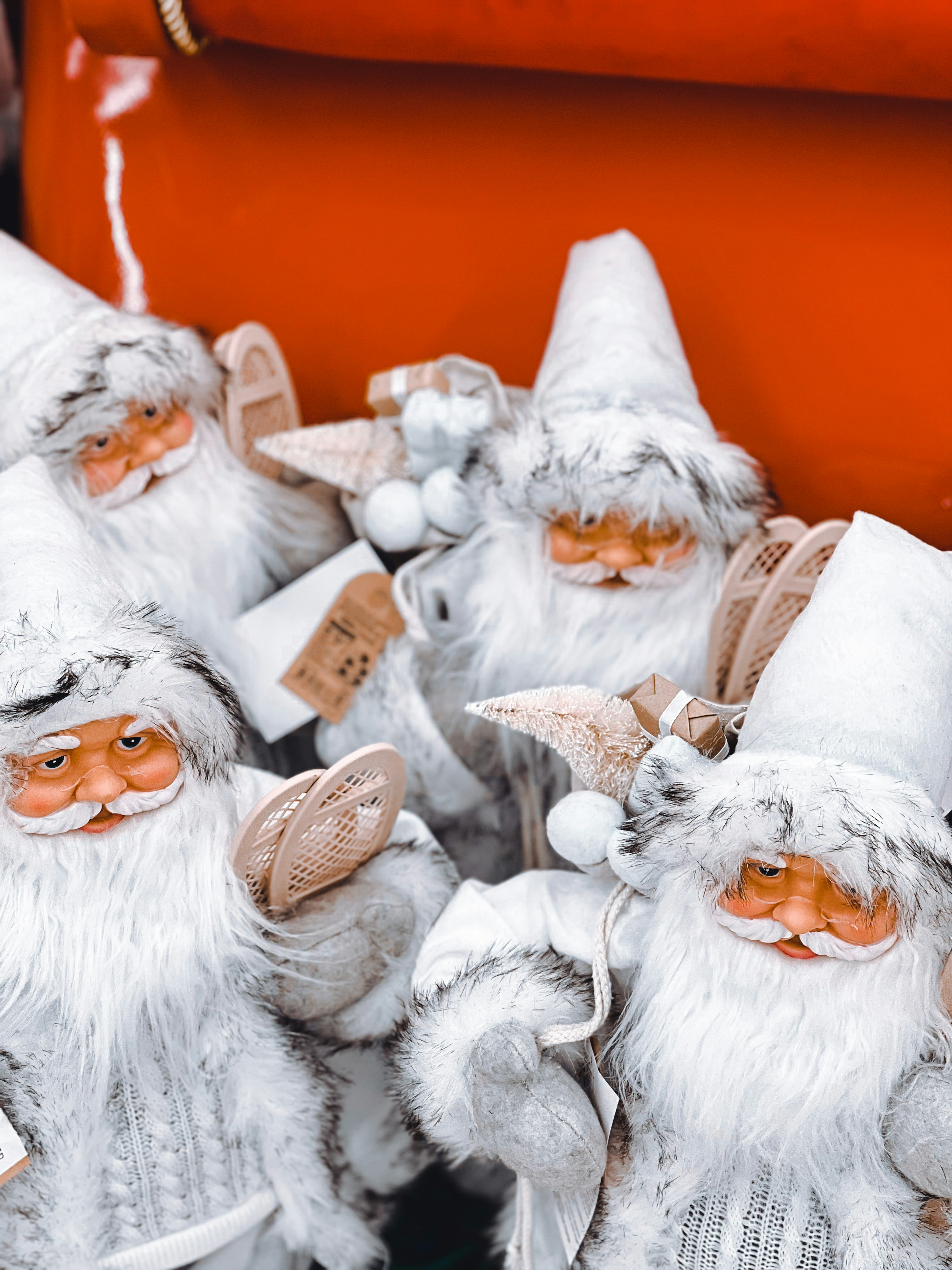 A group of white and gray gnomes sitting next to each other photo ...