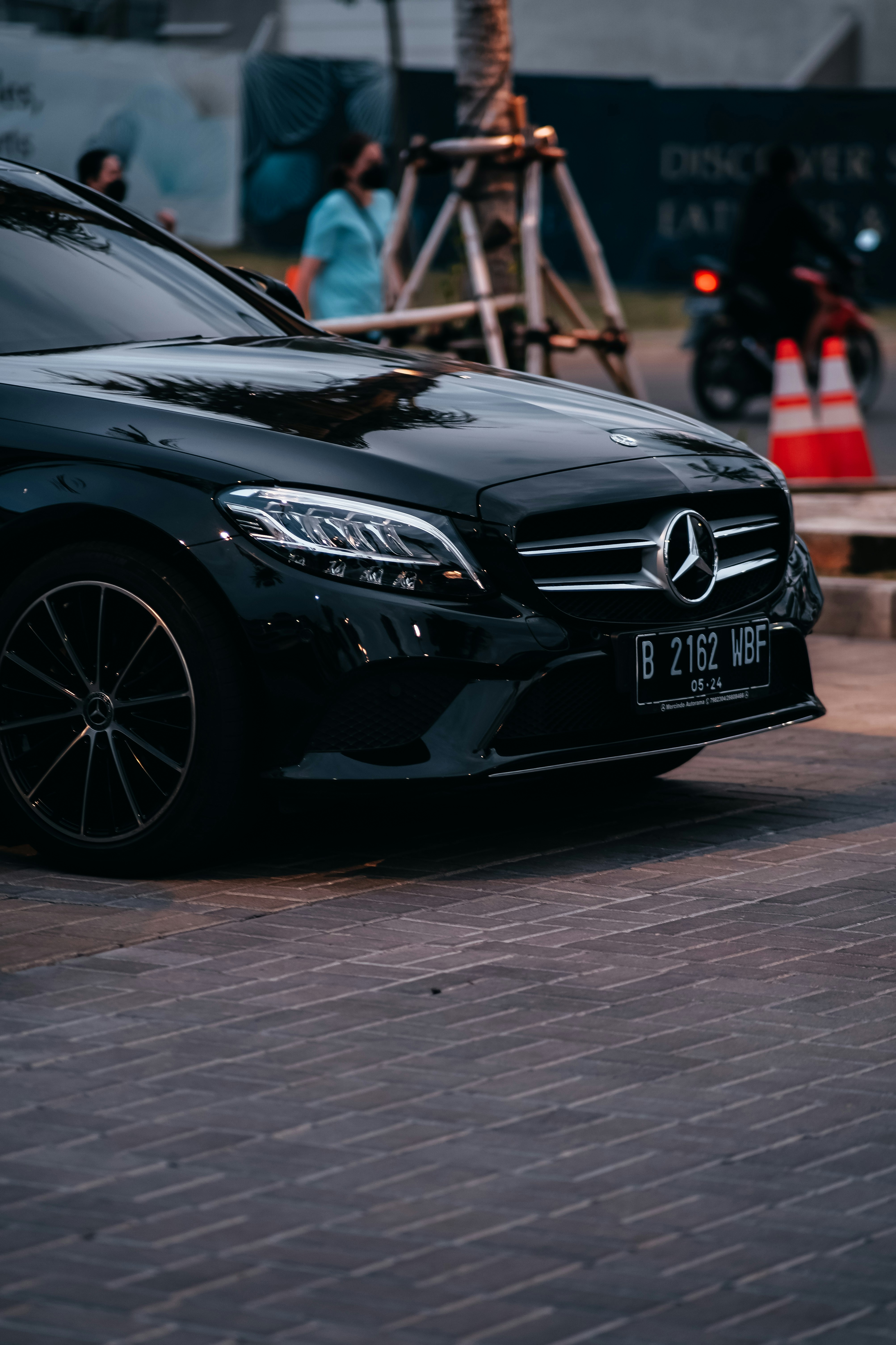 Low-Angle Pulse: The Black Mercedes at the Pedestrian Crossing
