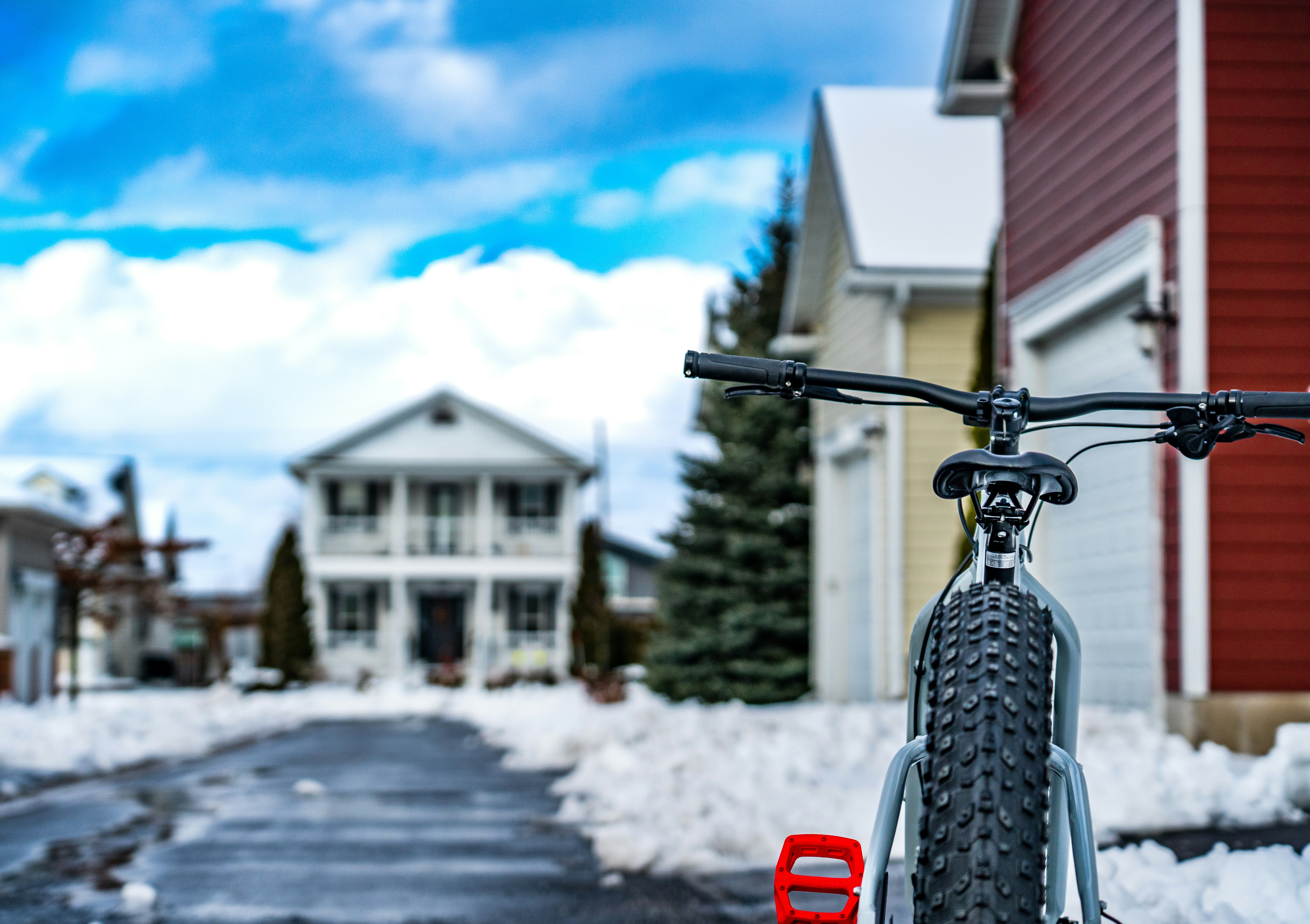 Toward the Quiet Street: A Bicycle Resting by the Snow-blanketed Lane