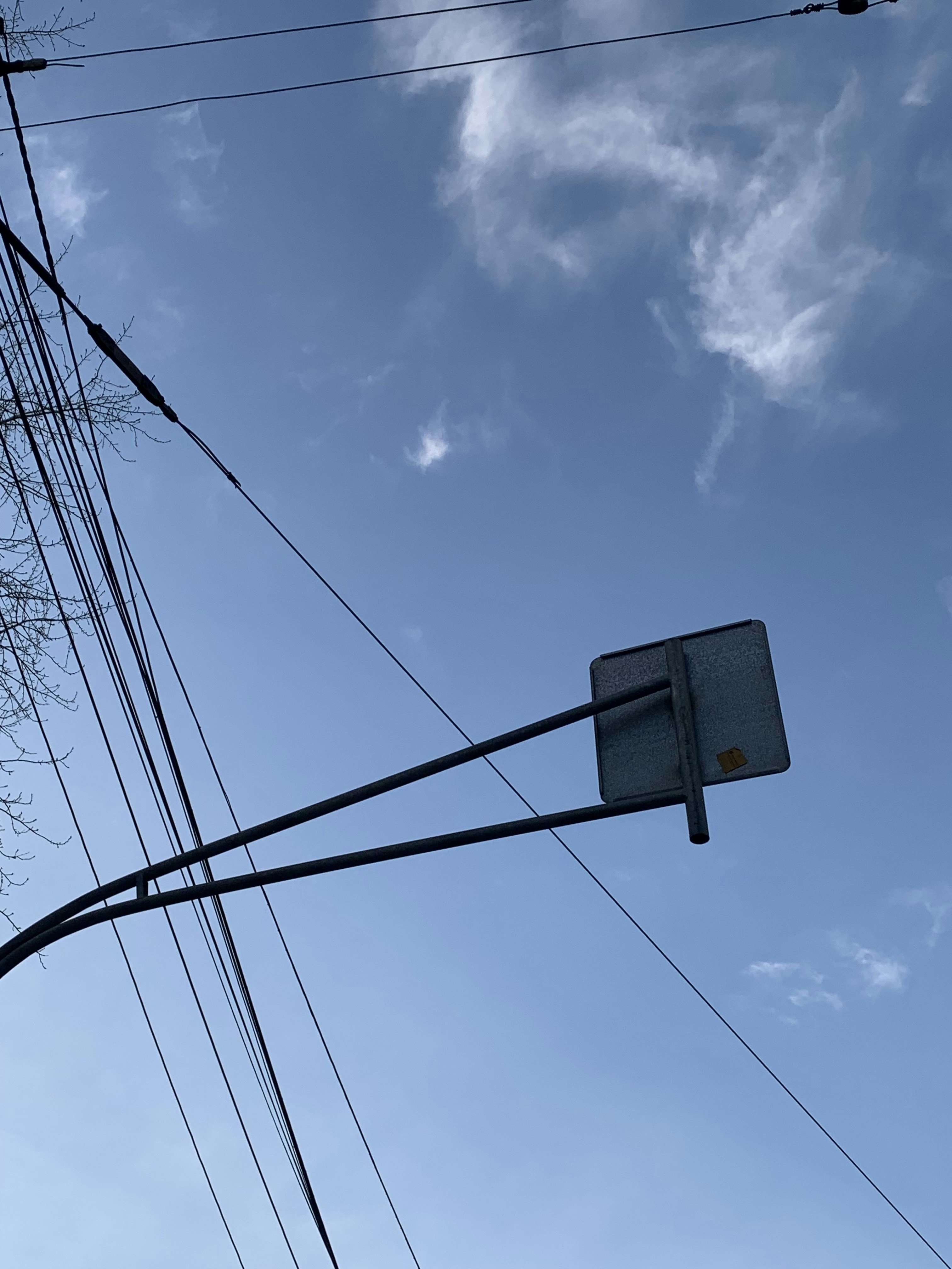 Skybound Wiring: A Streetlamp's Quiet Geometry Against the Blue