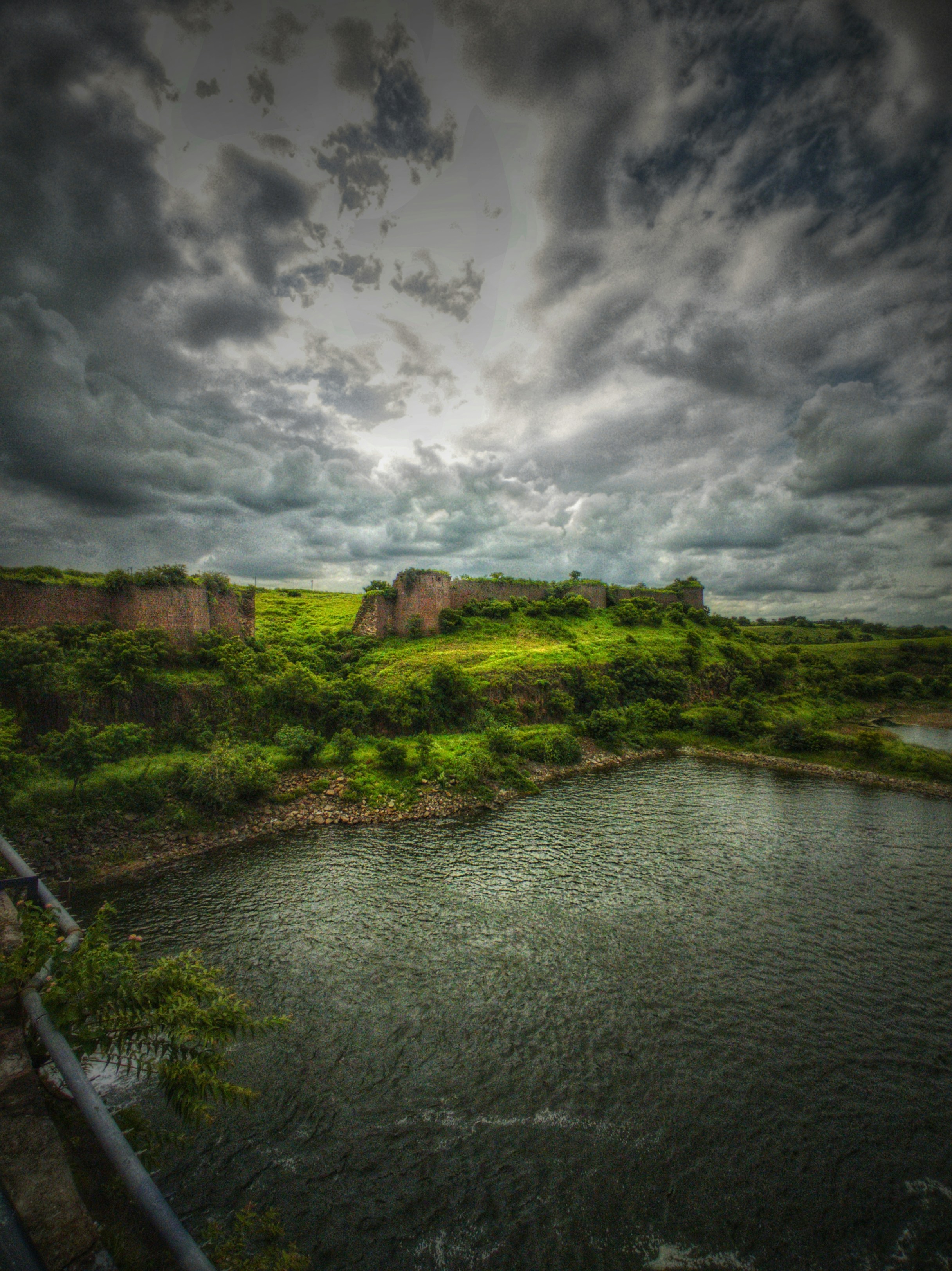 Heritage | a large body of water surrounded by a lush green field