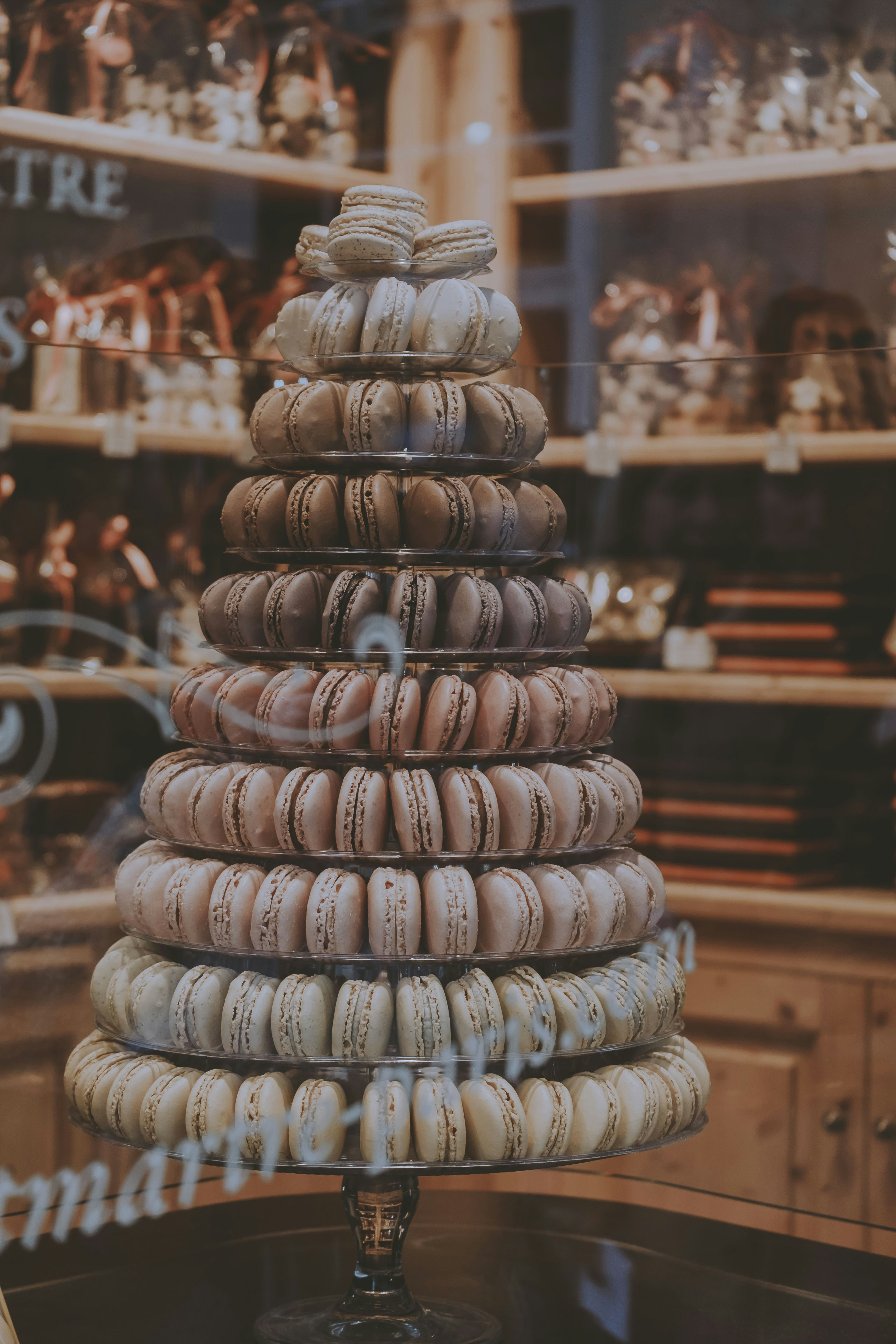 Stacked Macaron Cascade in a Pastry Window