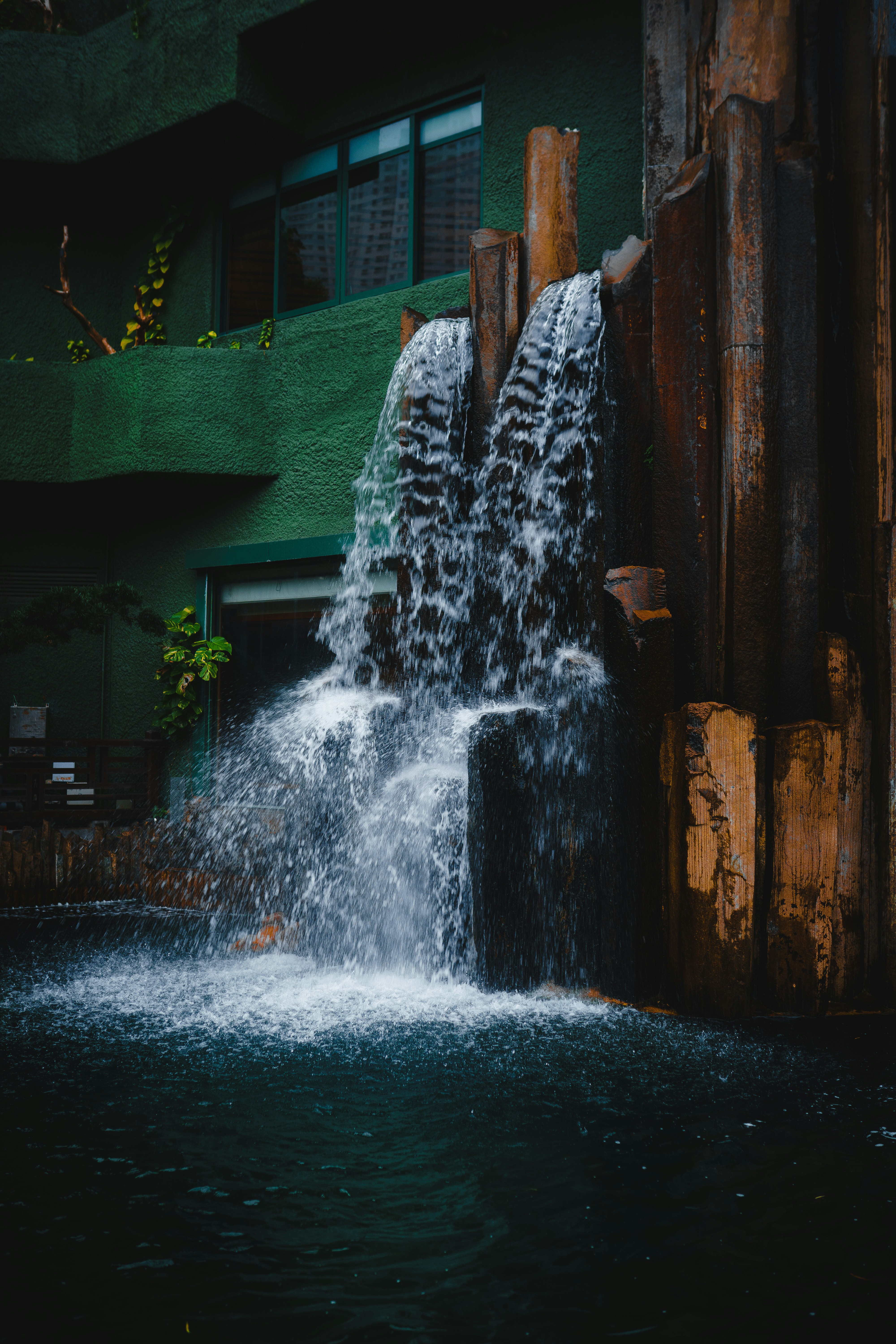 Vertical cascade at a green-clad building