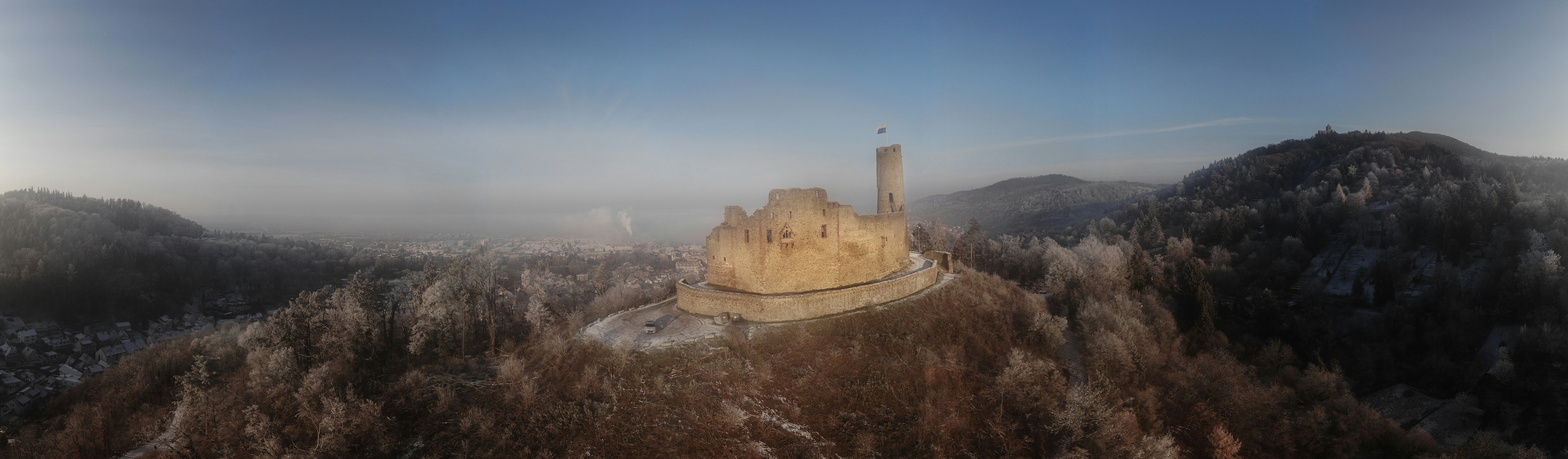 An aerial view of a castle in the middle of a forest photo – Free ...
