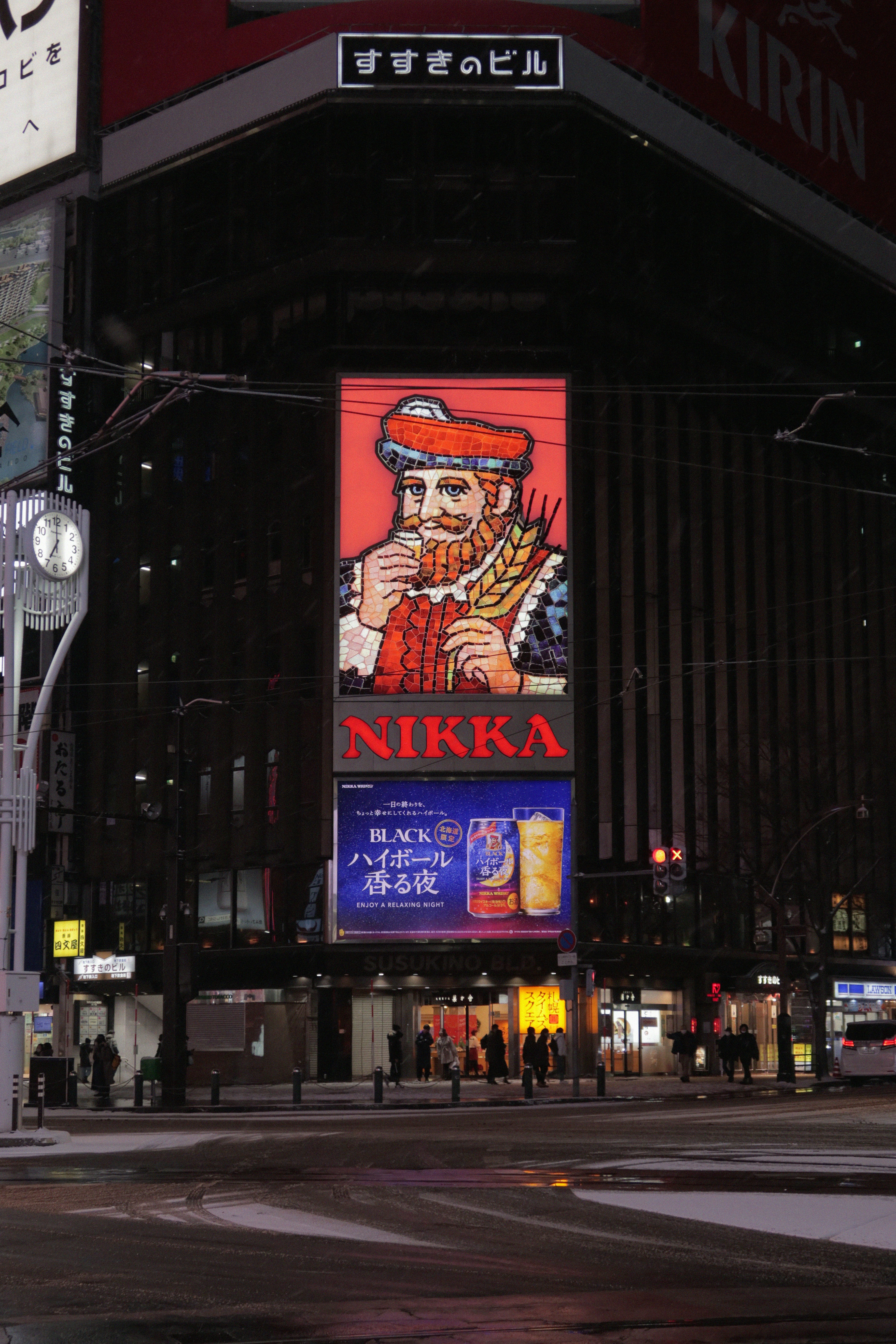 A large advertisement on the side of a building photo – Free Banner ...