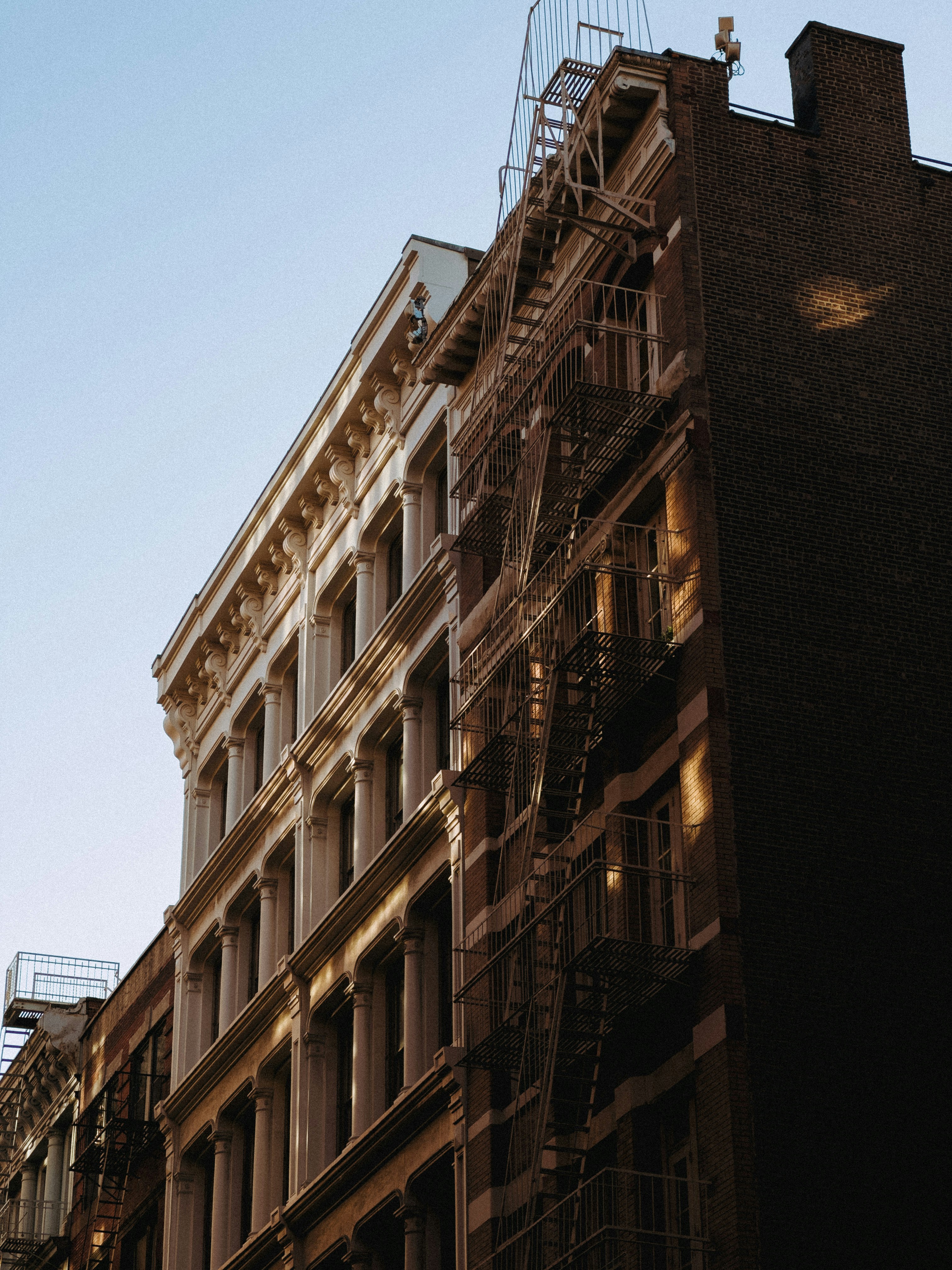 A fire escape on the side of a building photo – Free Building Image on ...