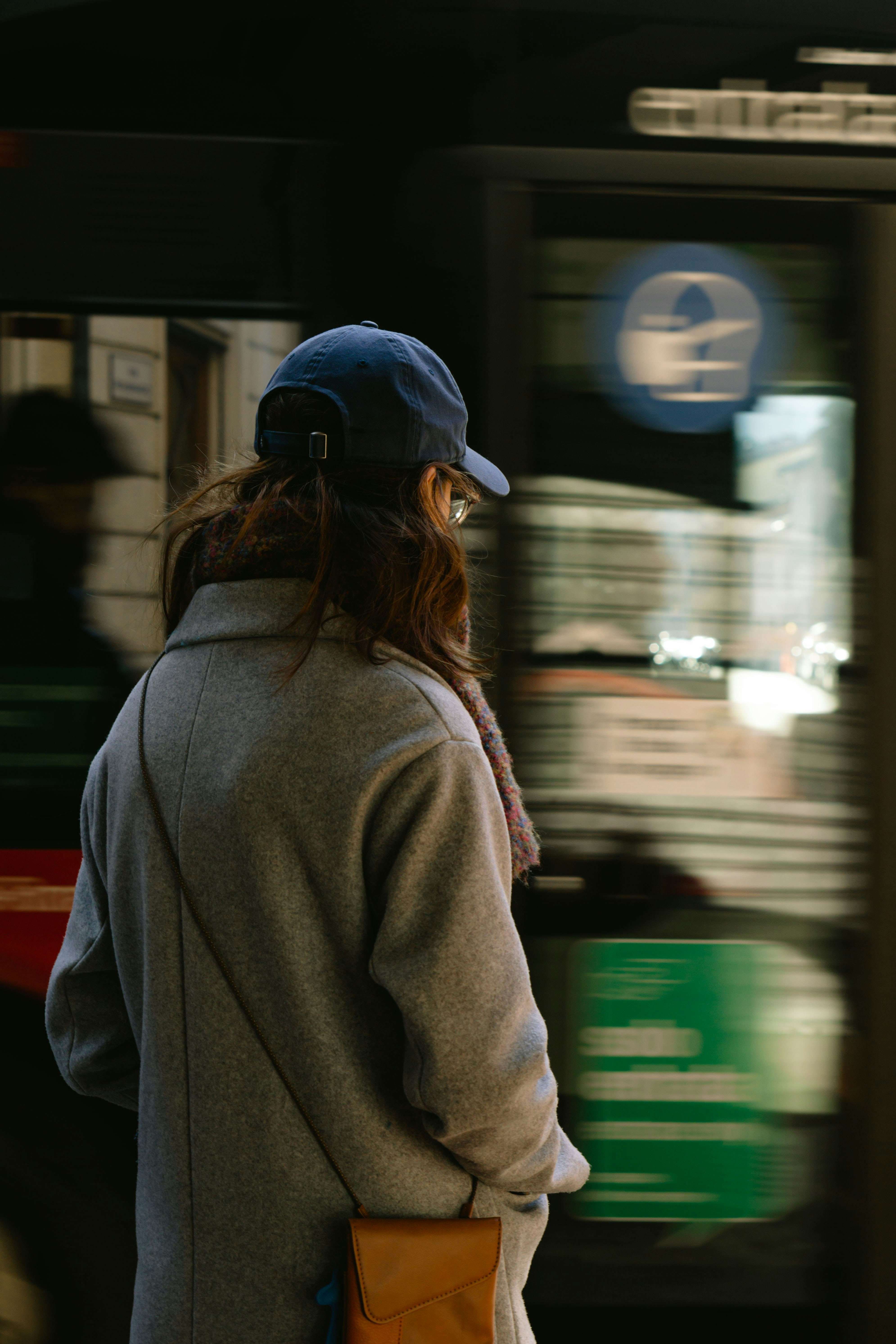 Paused in Motion: A City Portrait Against a Blurred Transit Backdrop