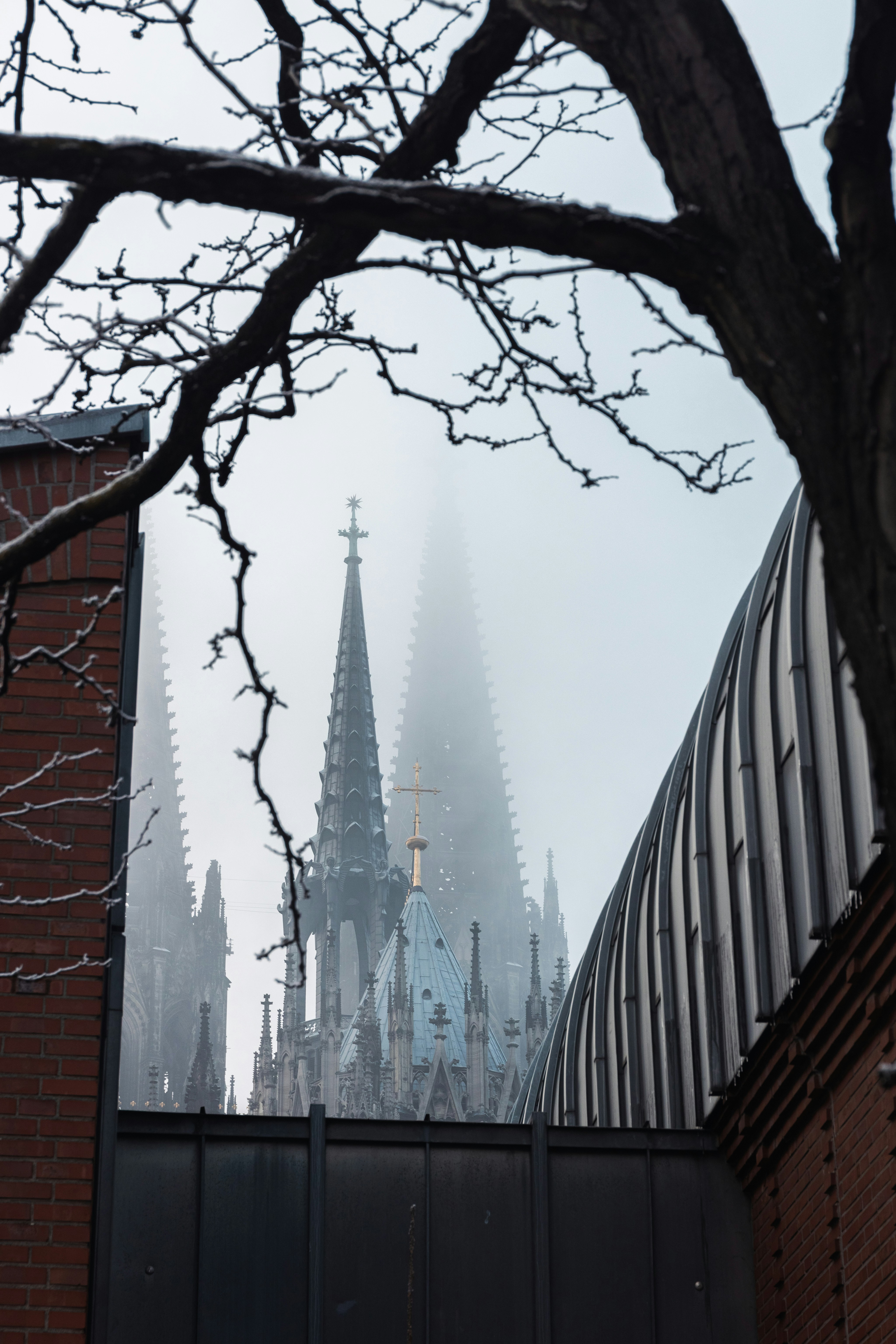 A very tall cathedral towering over a city photo – Free Building Image ...