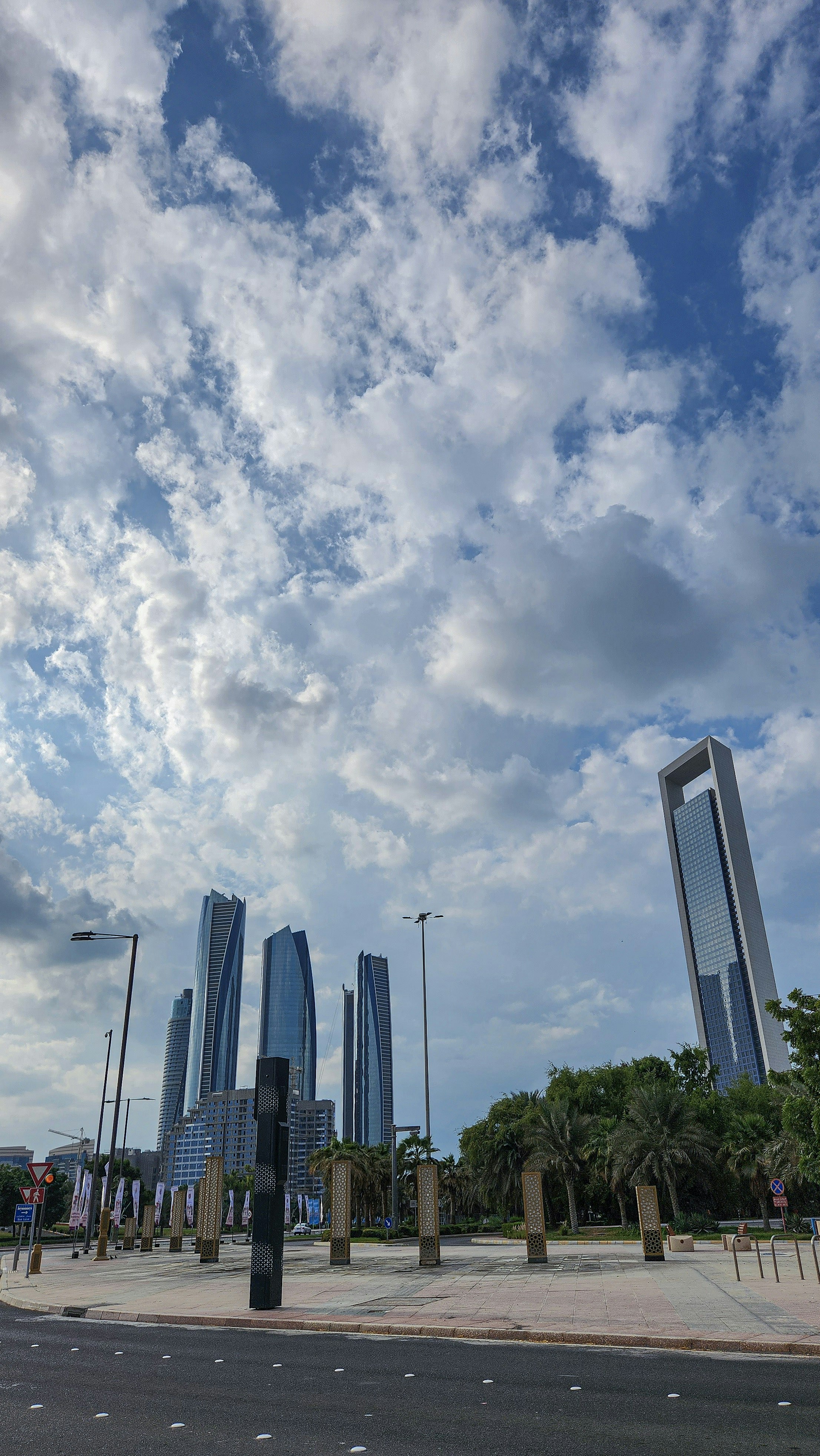 Glass Giants Above the Palm-Fringed Plaza