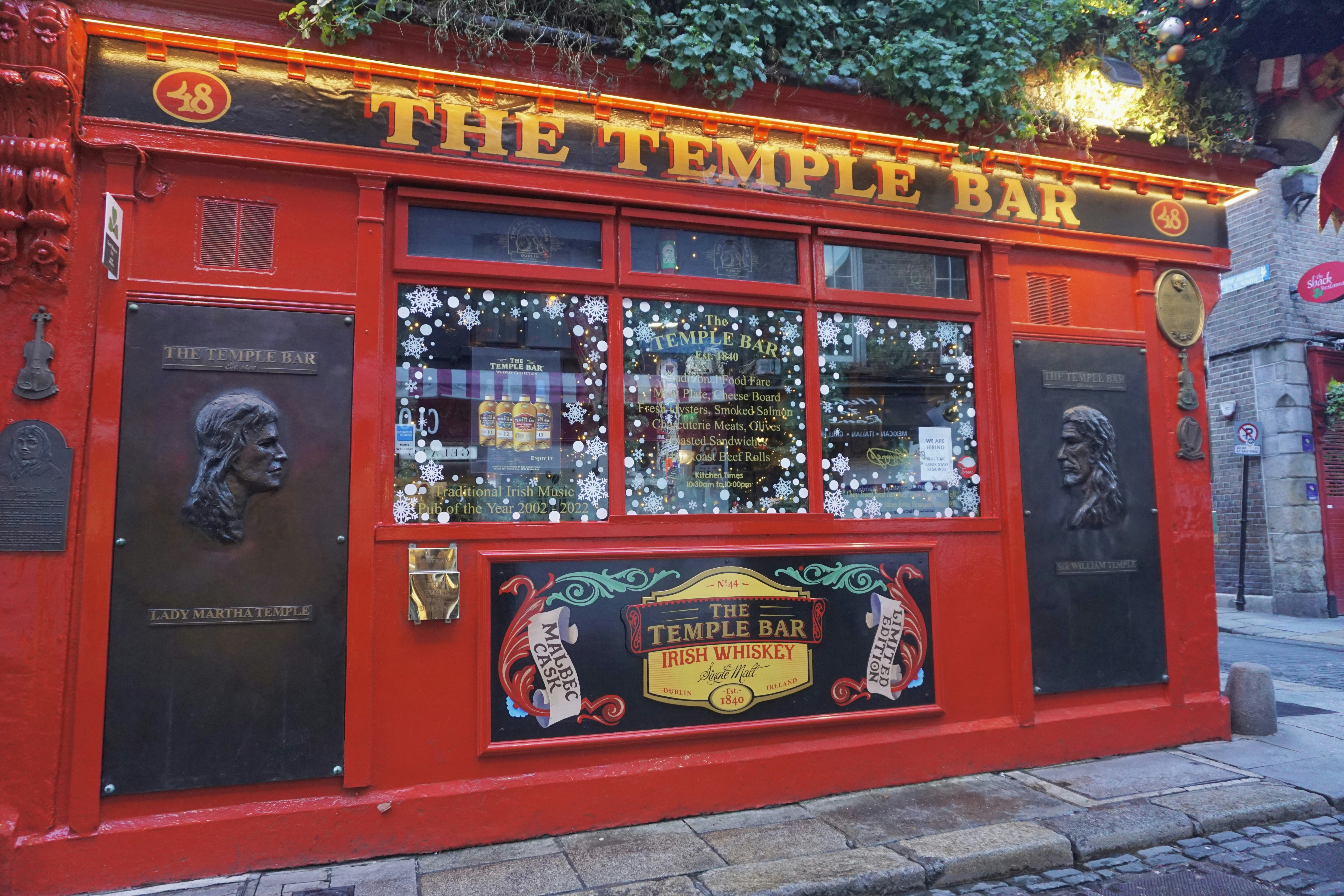 A red building with a sign that says the temple bar photo – Free Temple ...