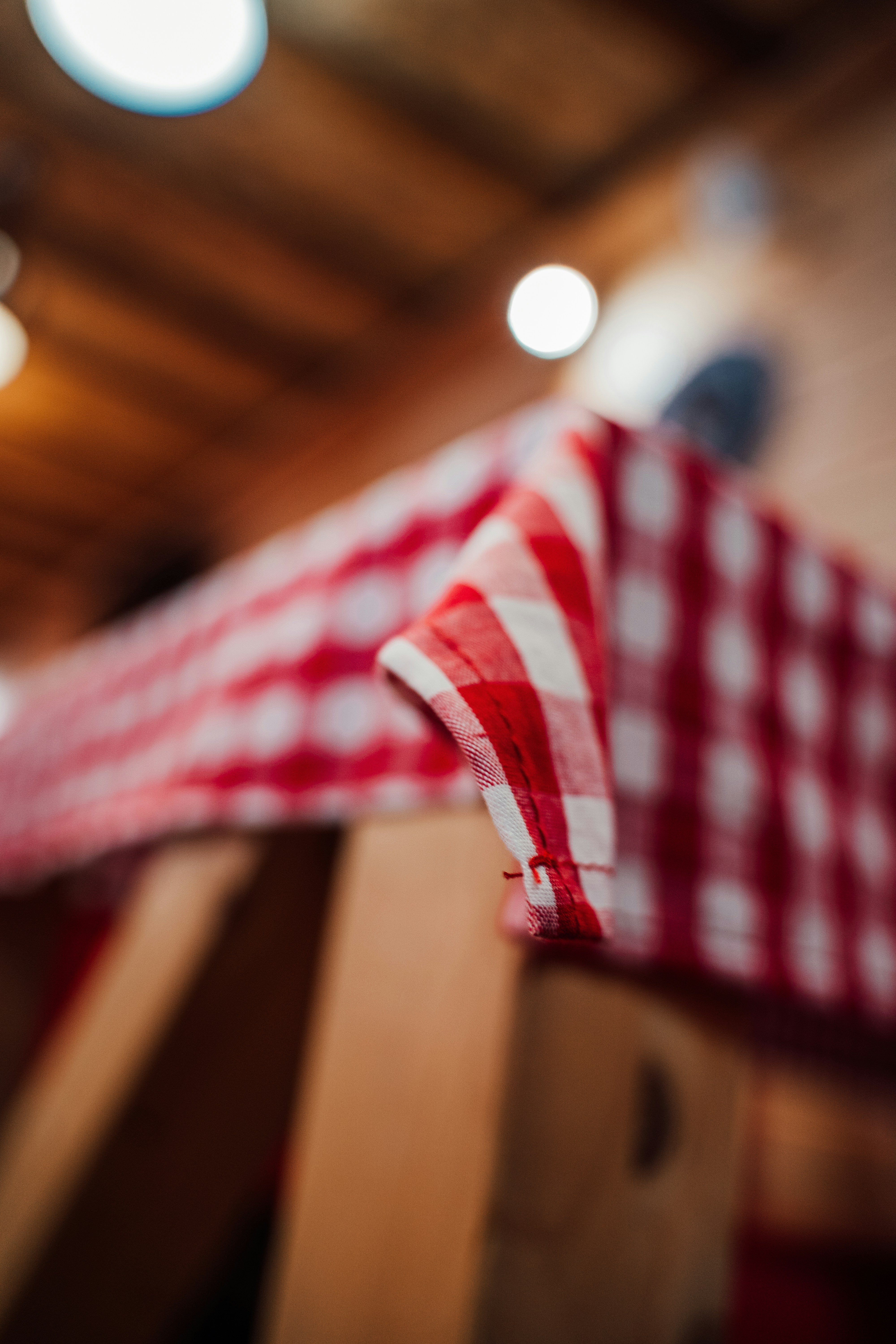 A red and white checkered cloth hanging from a ceiling photo – Free ...