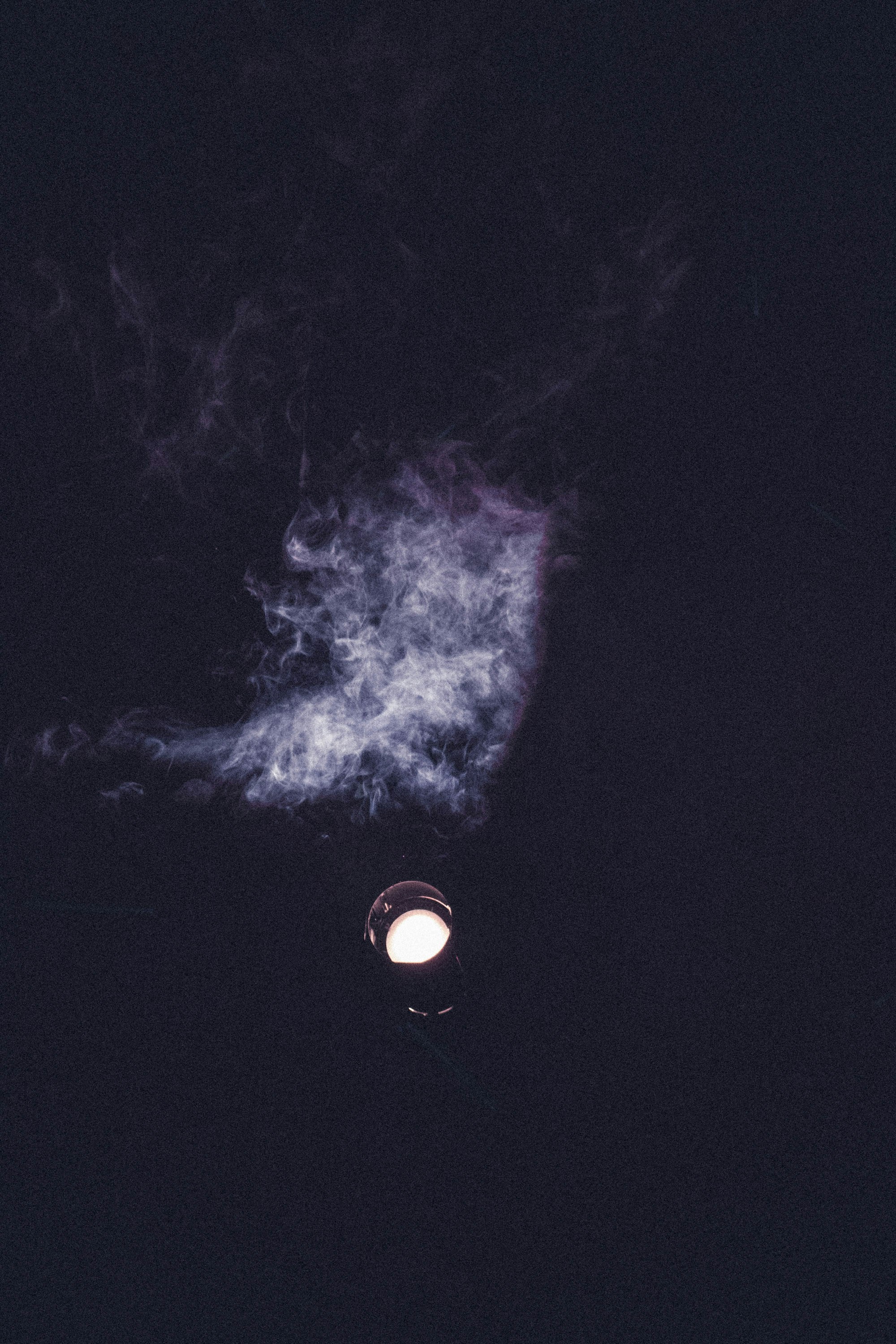 A street light with smoke coming out of it photo – Free Smoke Image on ...