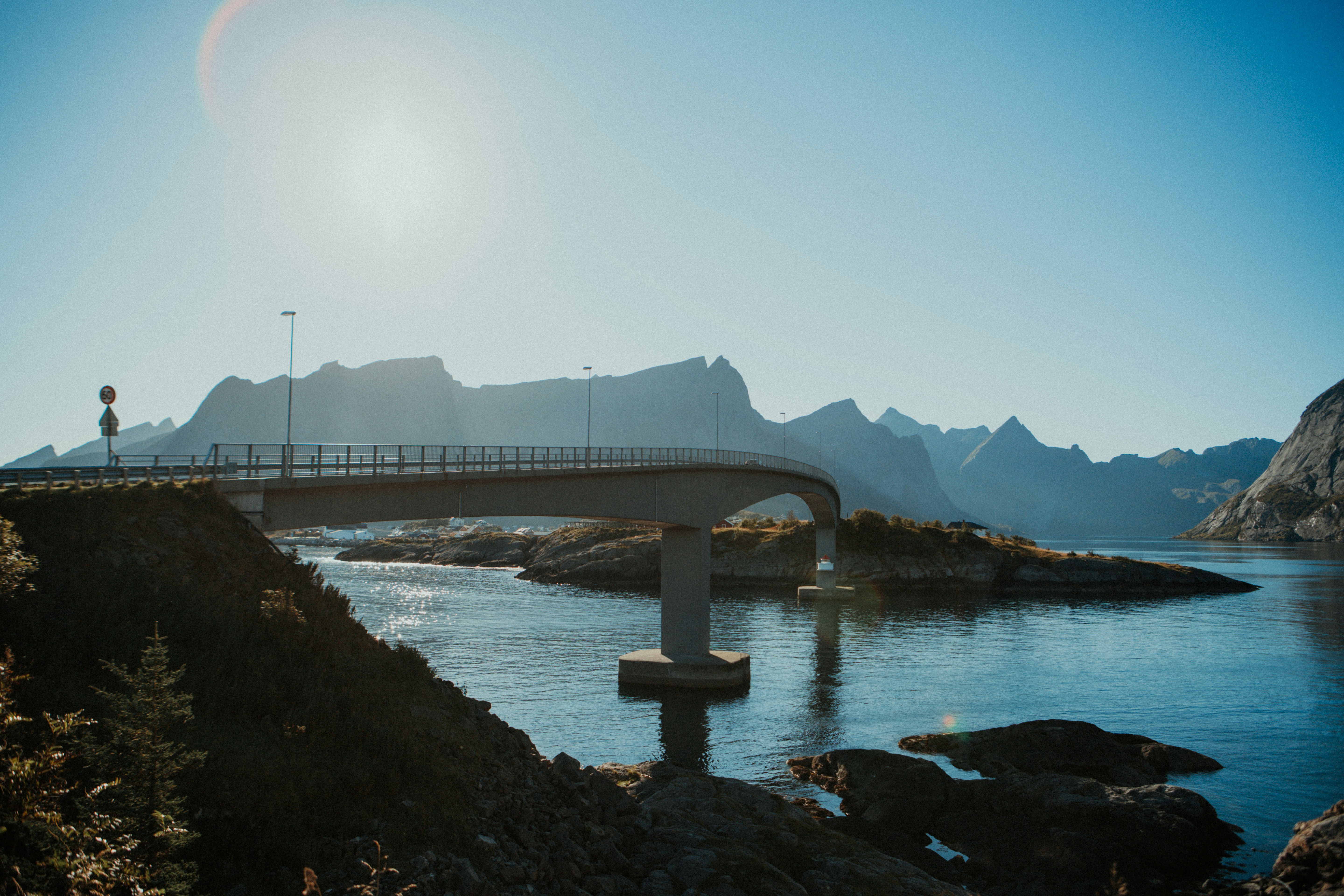 Bridge Pillar Over the Fjord: Quiet Crossing Beneath Jagged Peaks