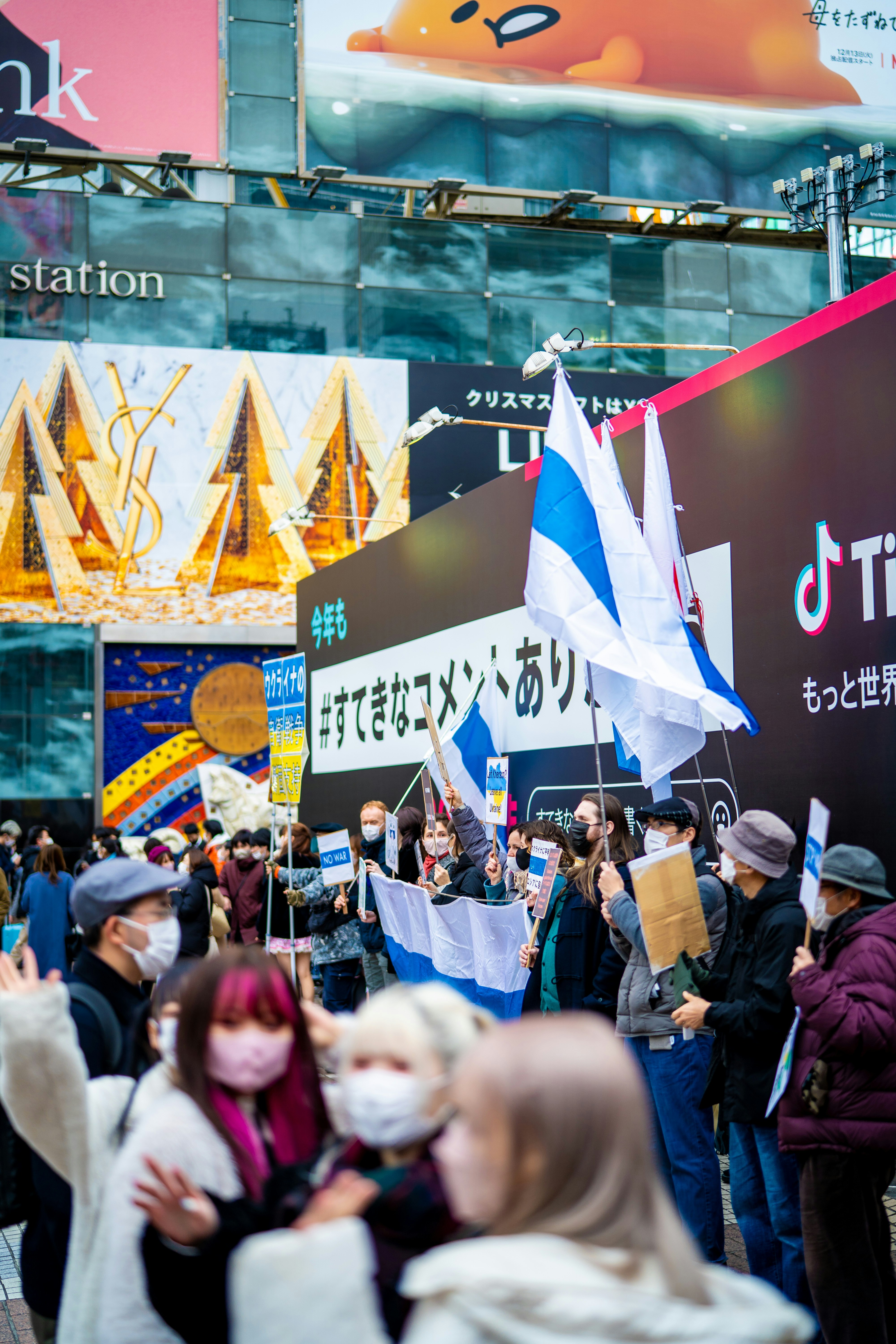 A crowd of people standing around each other photo – Free Current ...