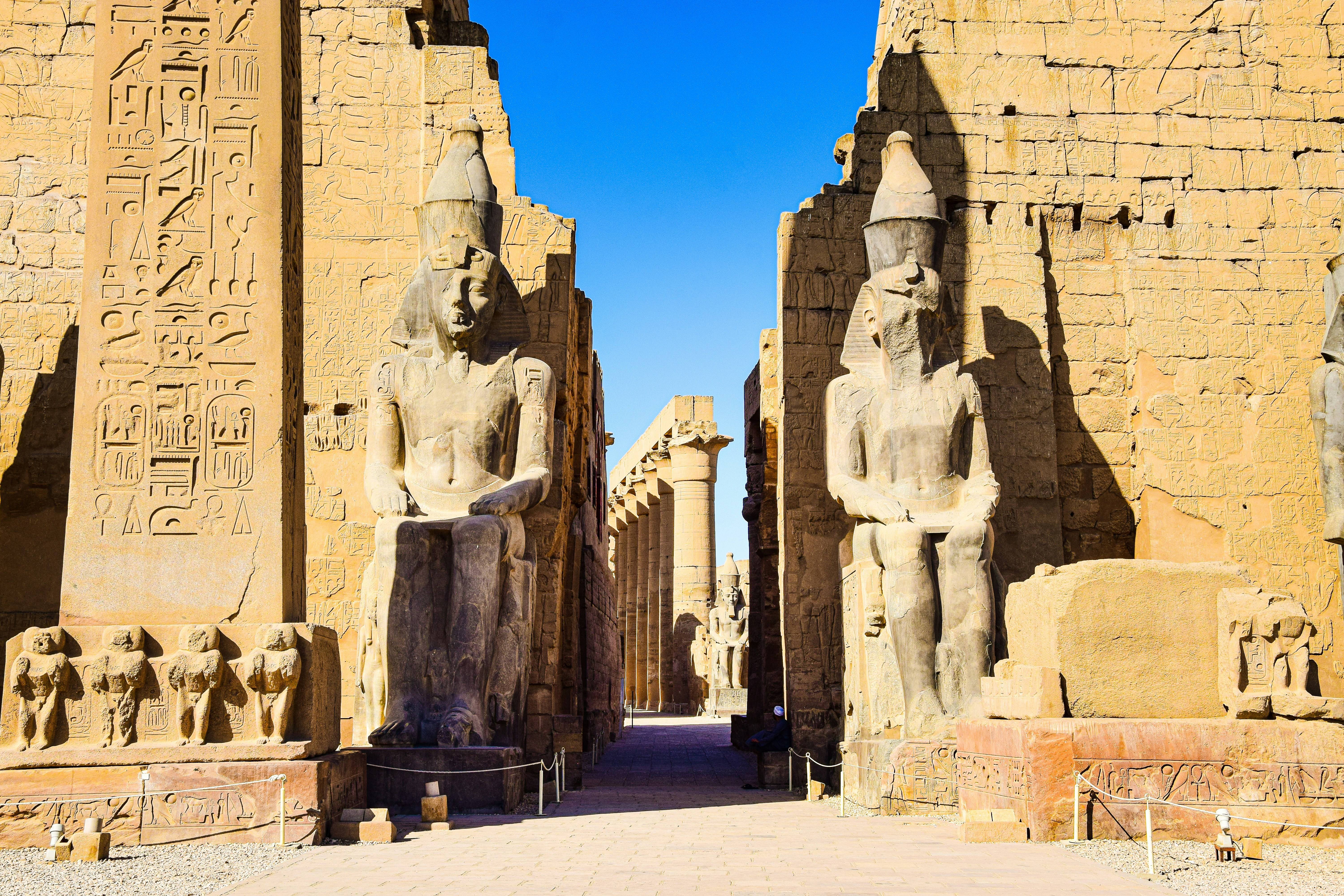 The entrance to an ancient egyptian temple with statues photo – Free ...