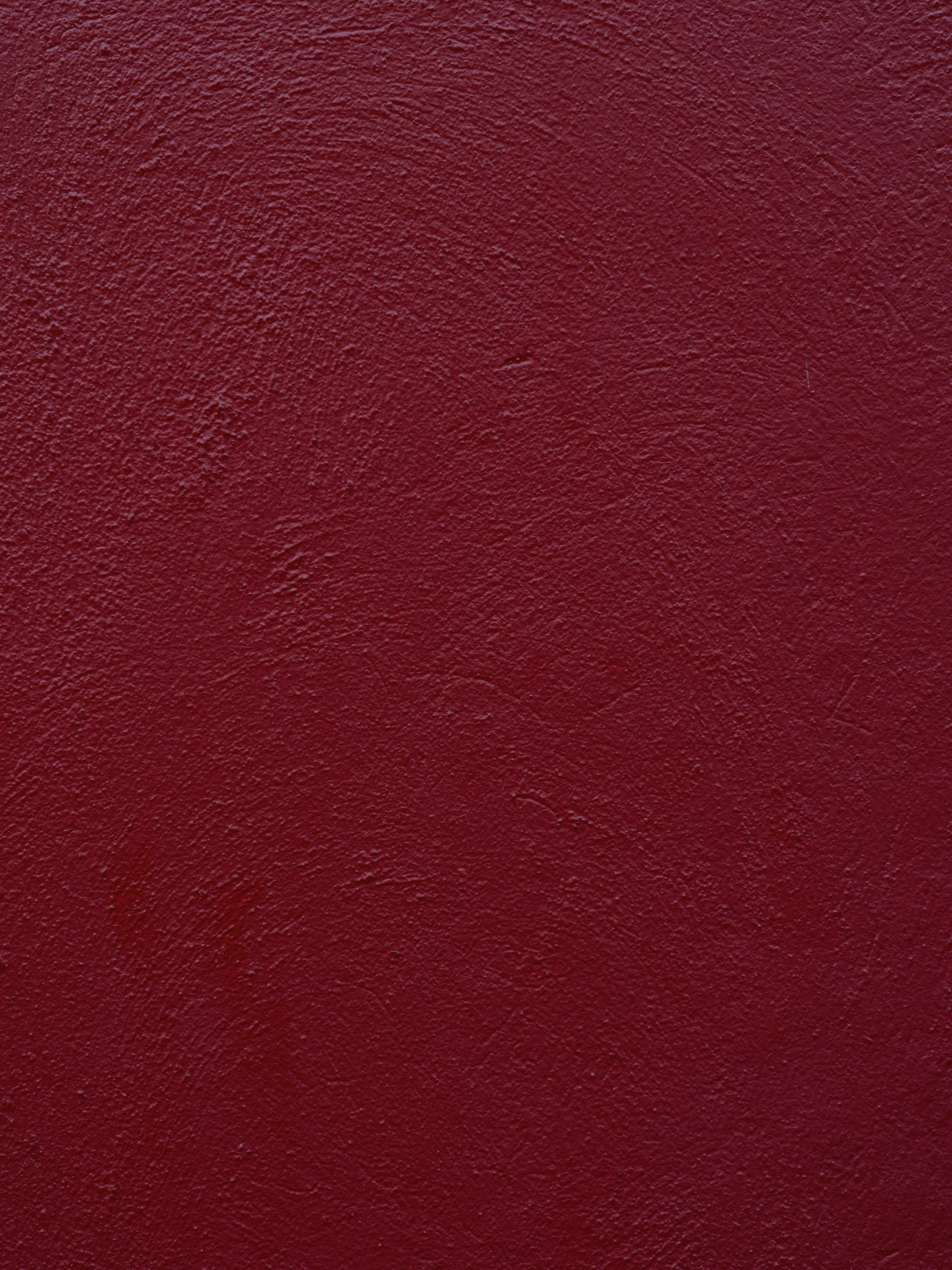 A close up of a red wall with a white clock on it photo – Free Red ...