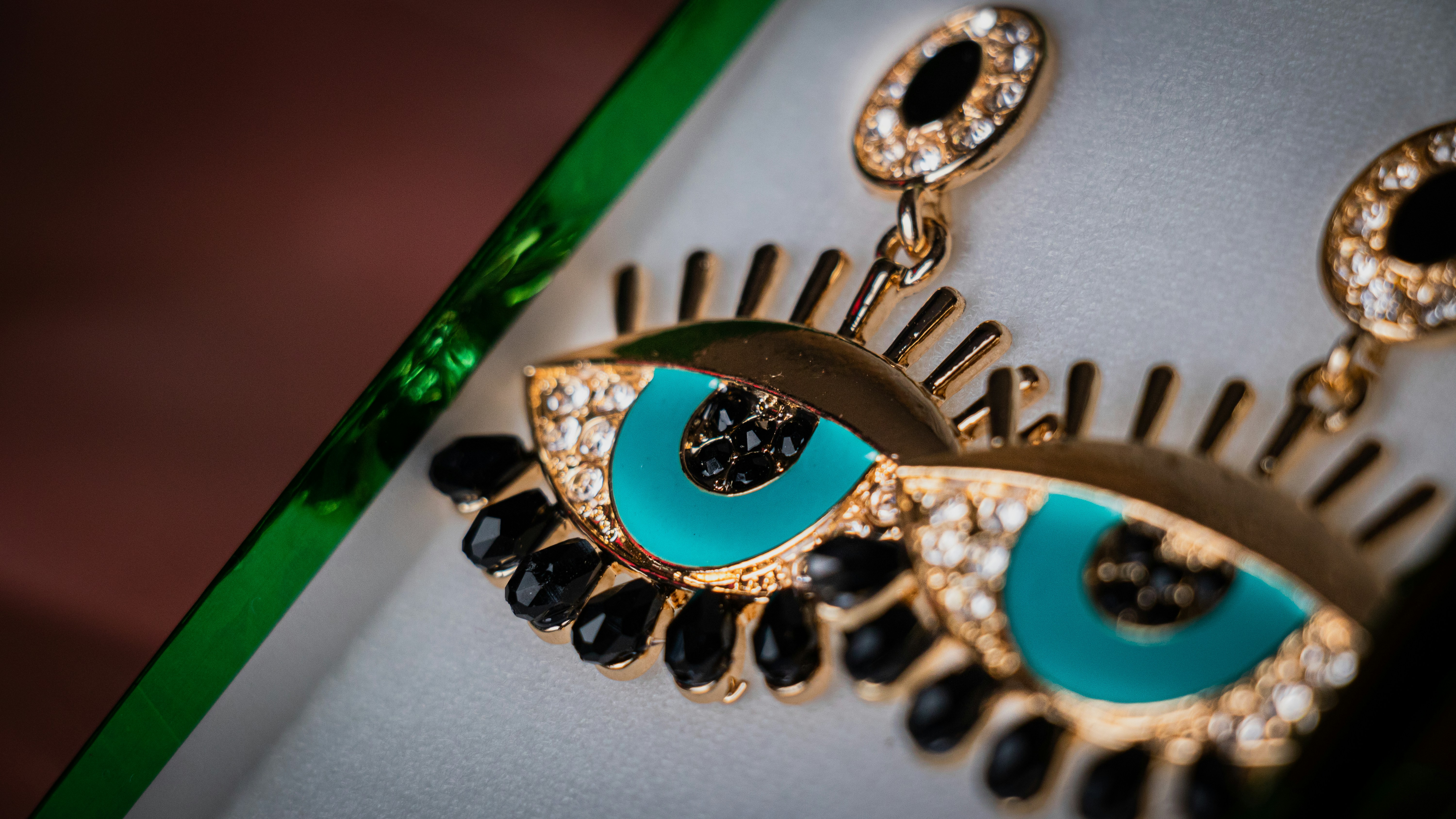 Gilded Eye: Ornate Jewel-Topped Mask Close-Up