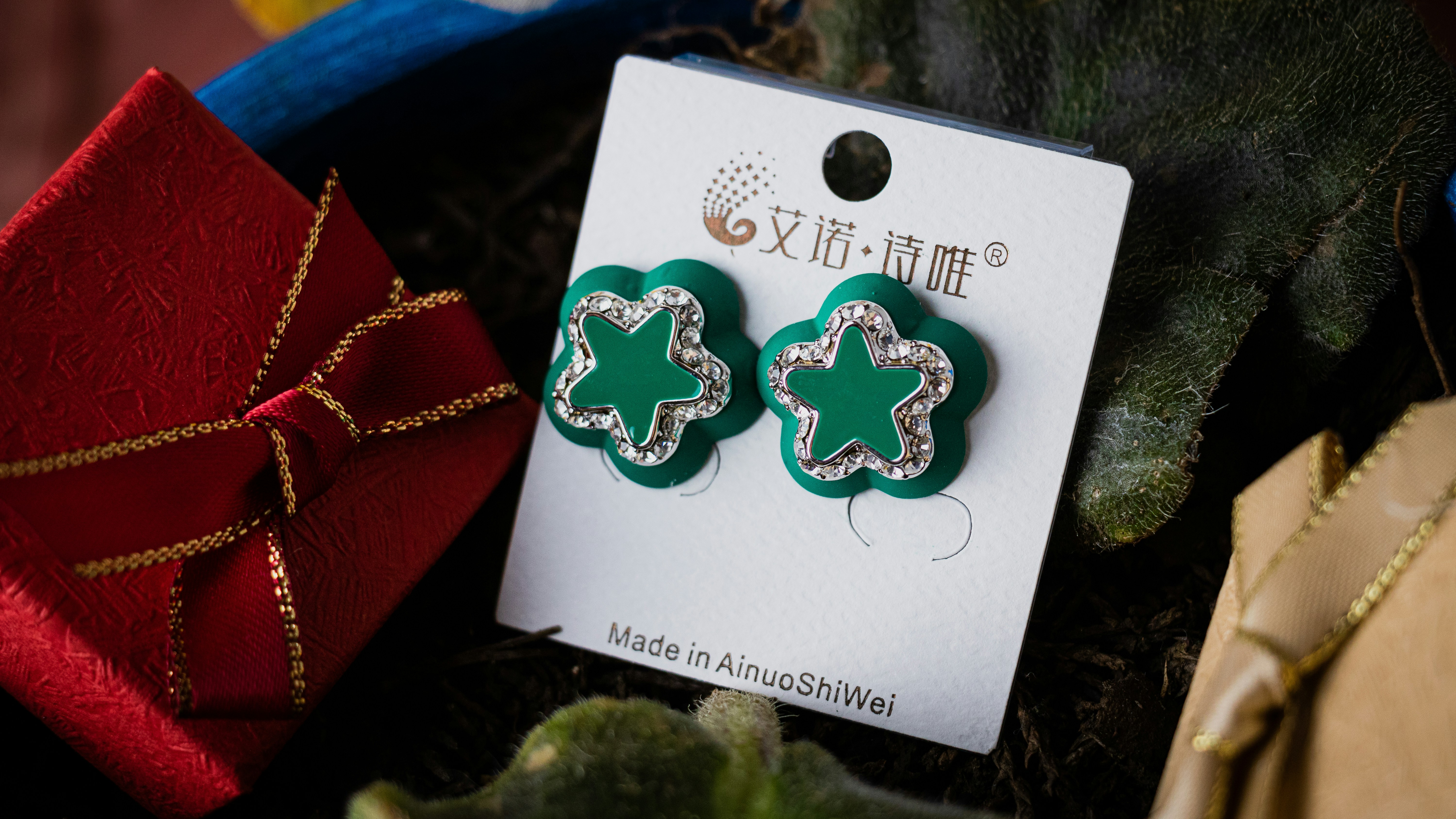 Starry Green Earrings on Gift Card Cardboard Under Festive Décor