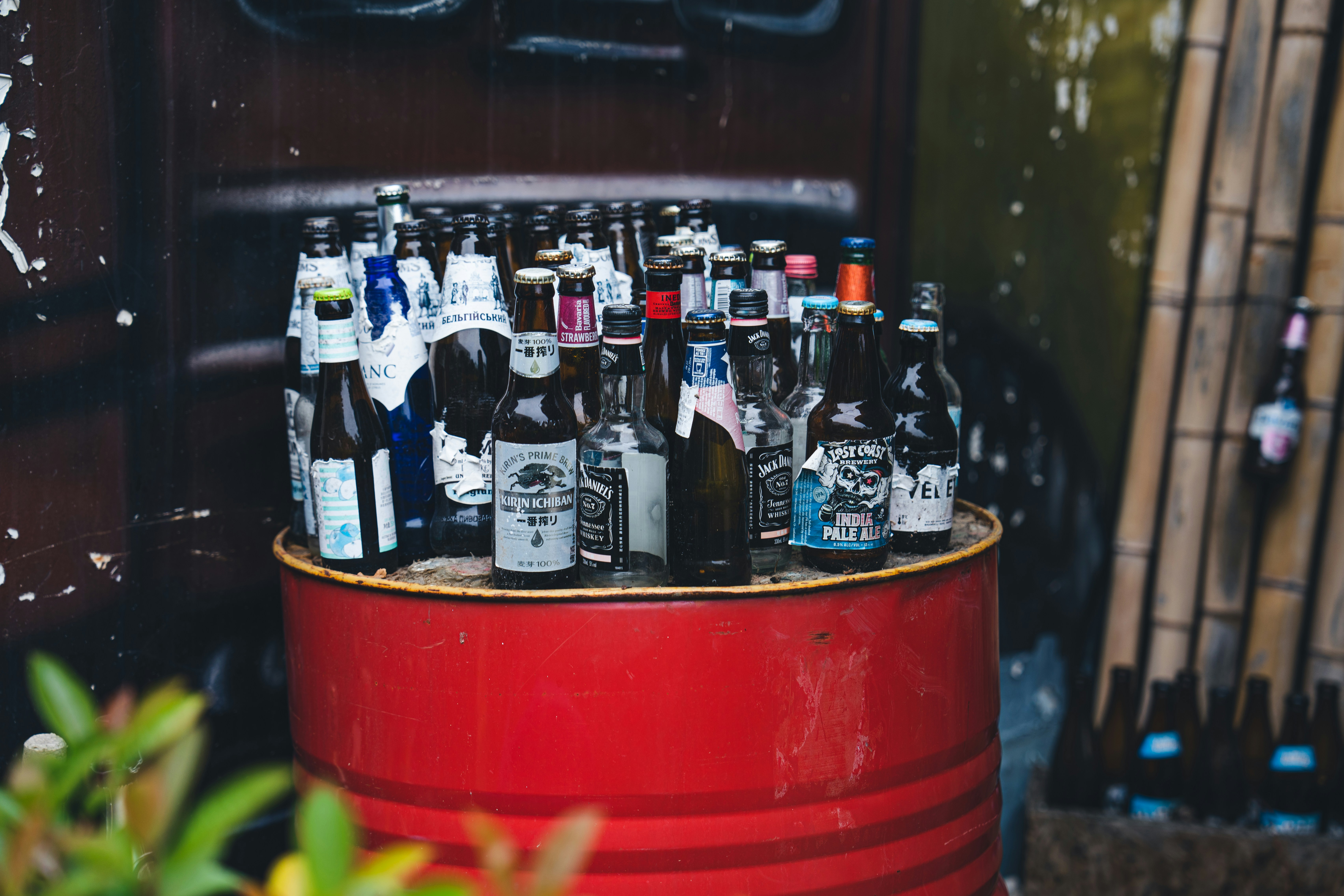 A red barrel filled with lots of bottles of beer photo – Free Alcohol ...