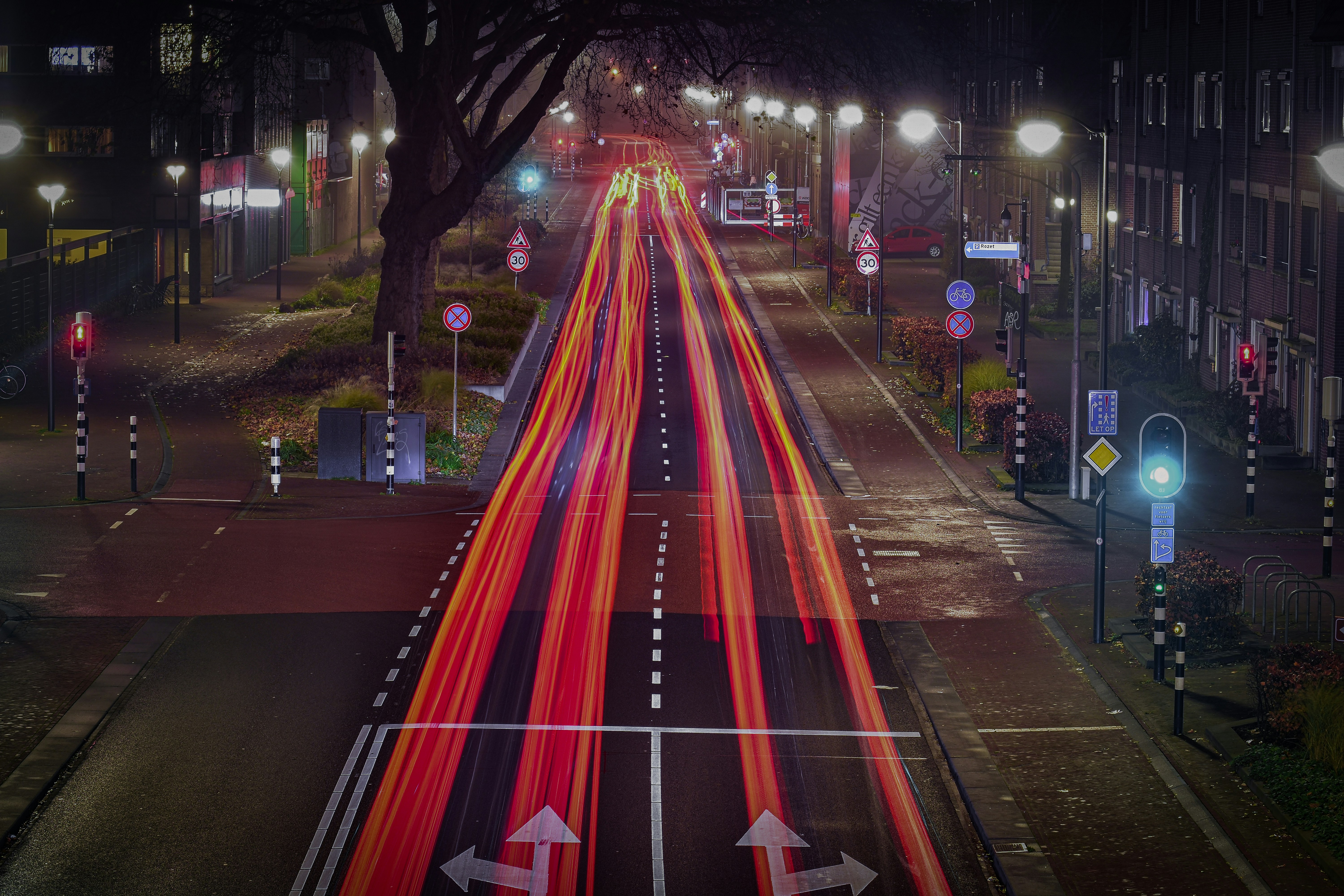 A city street at night with traffic lights photo – Free City at night ...