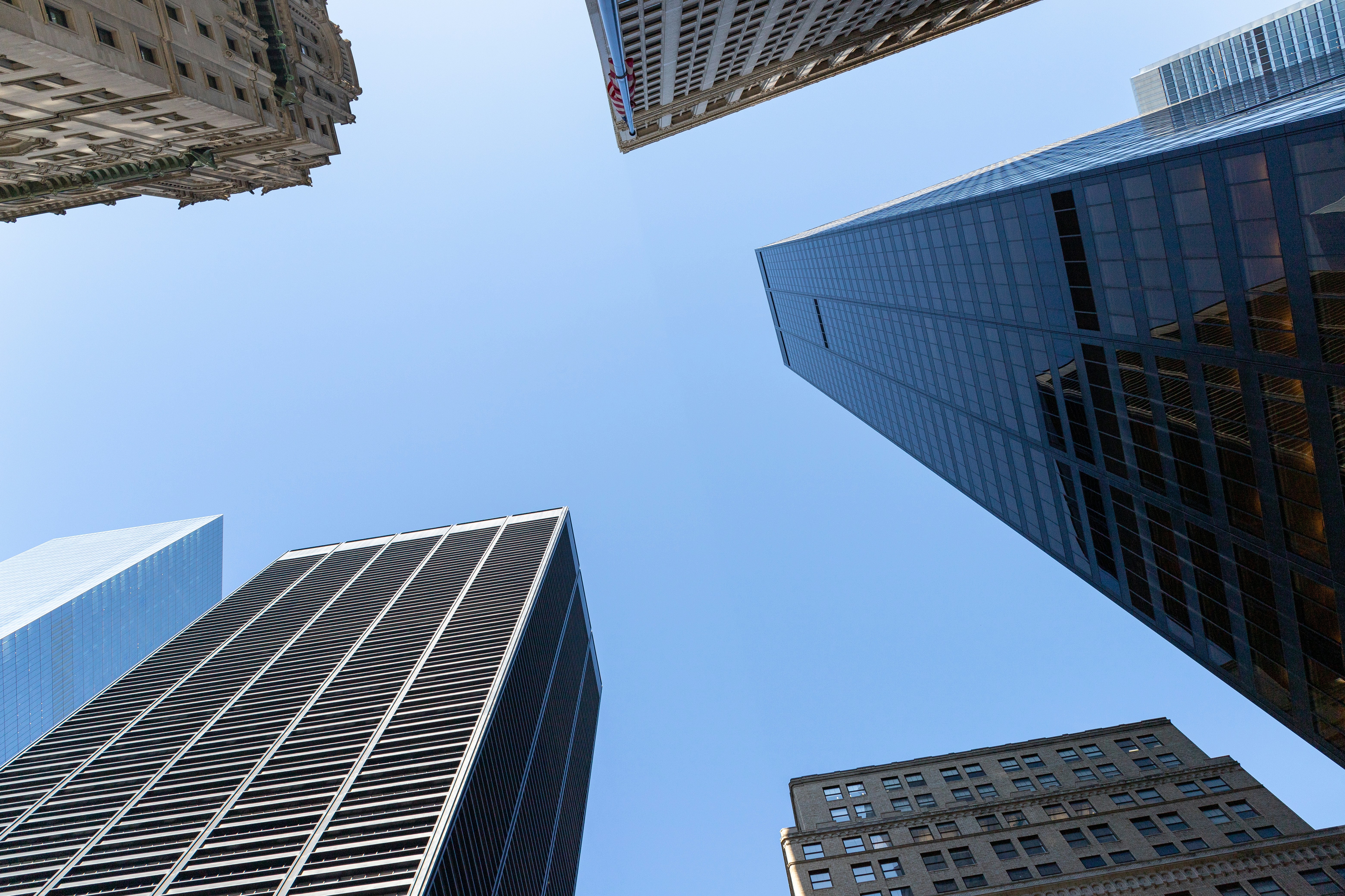 Looking up at tall buildings in a city photo – Free Ny Image on Unsplash