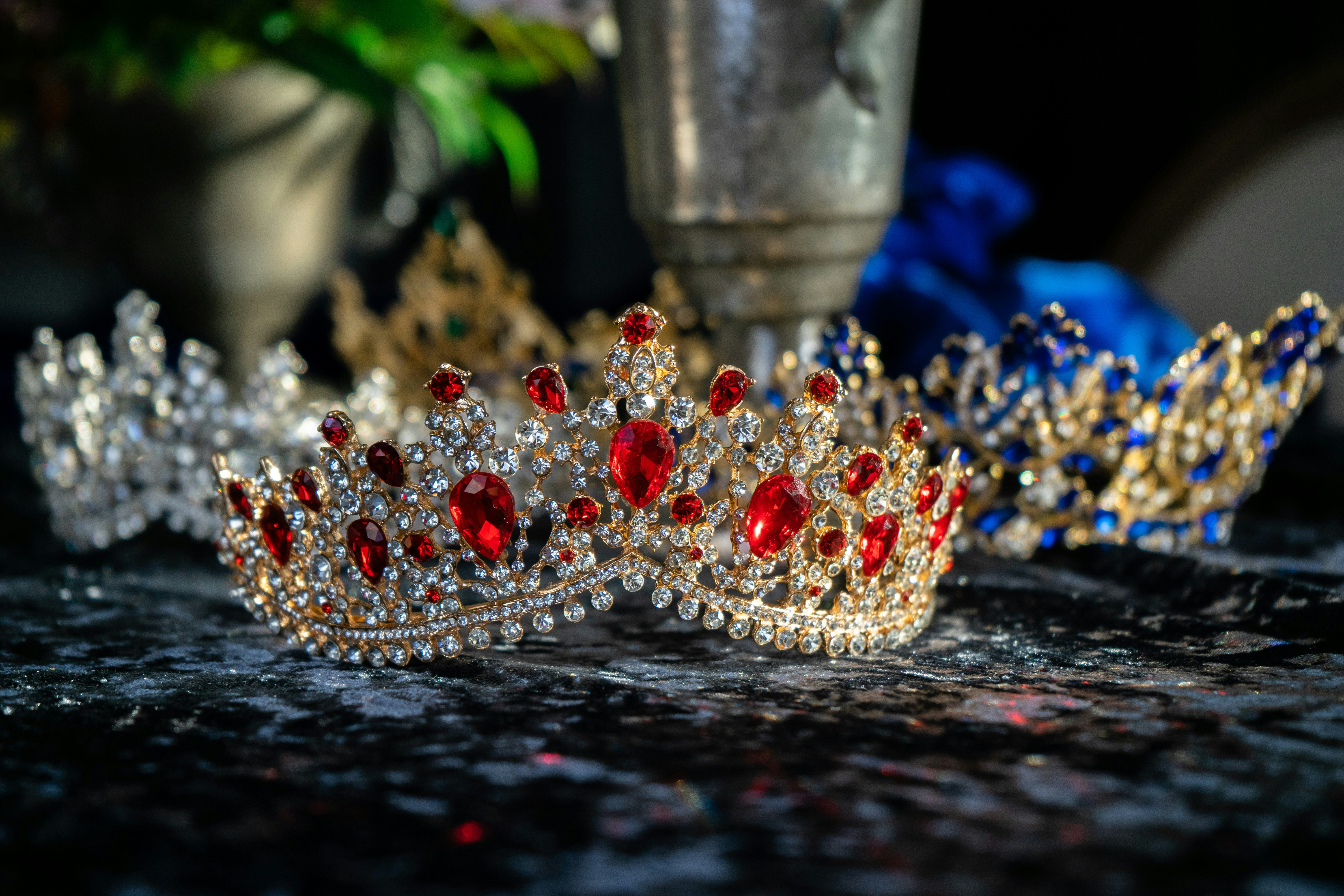 A group of tiaras sitting on top of a table photo – Free Jewelry Image ...