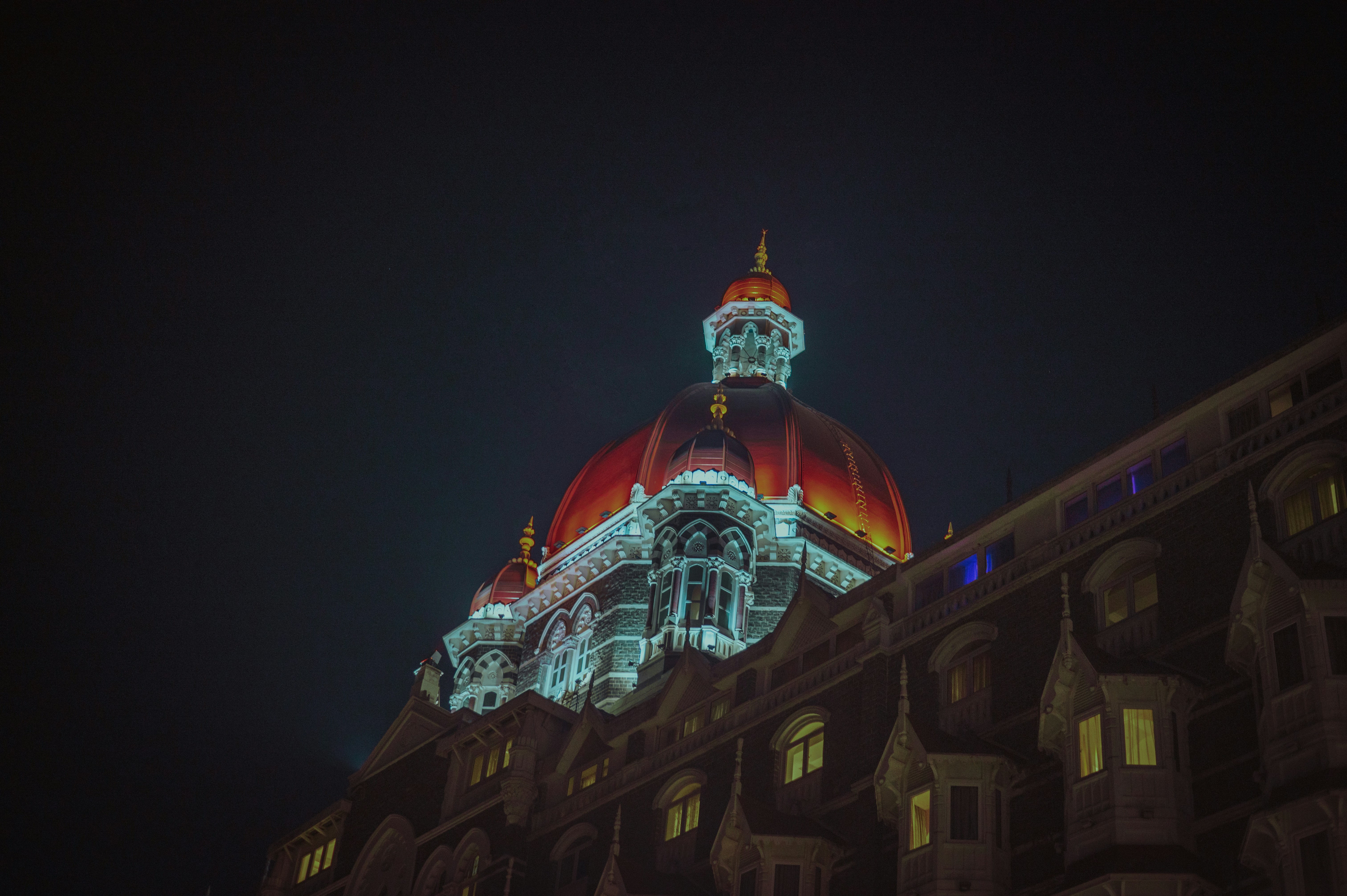 A large building with a lit up dome at night photo – Free Taj hotel ...