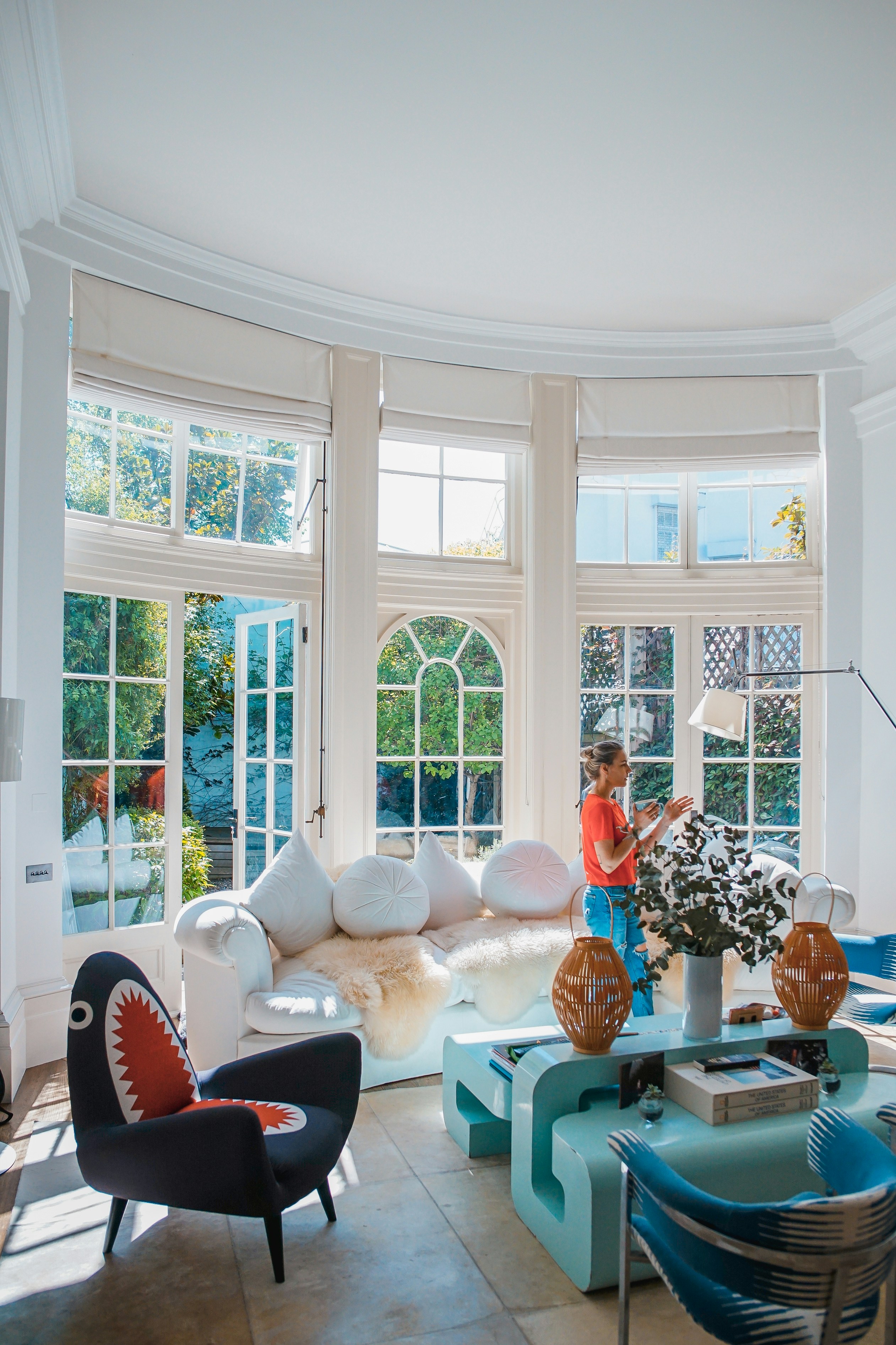 A living room filled with furniture and large windows photo – Free ...