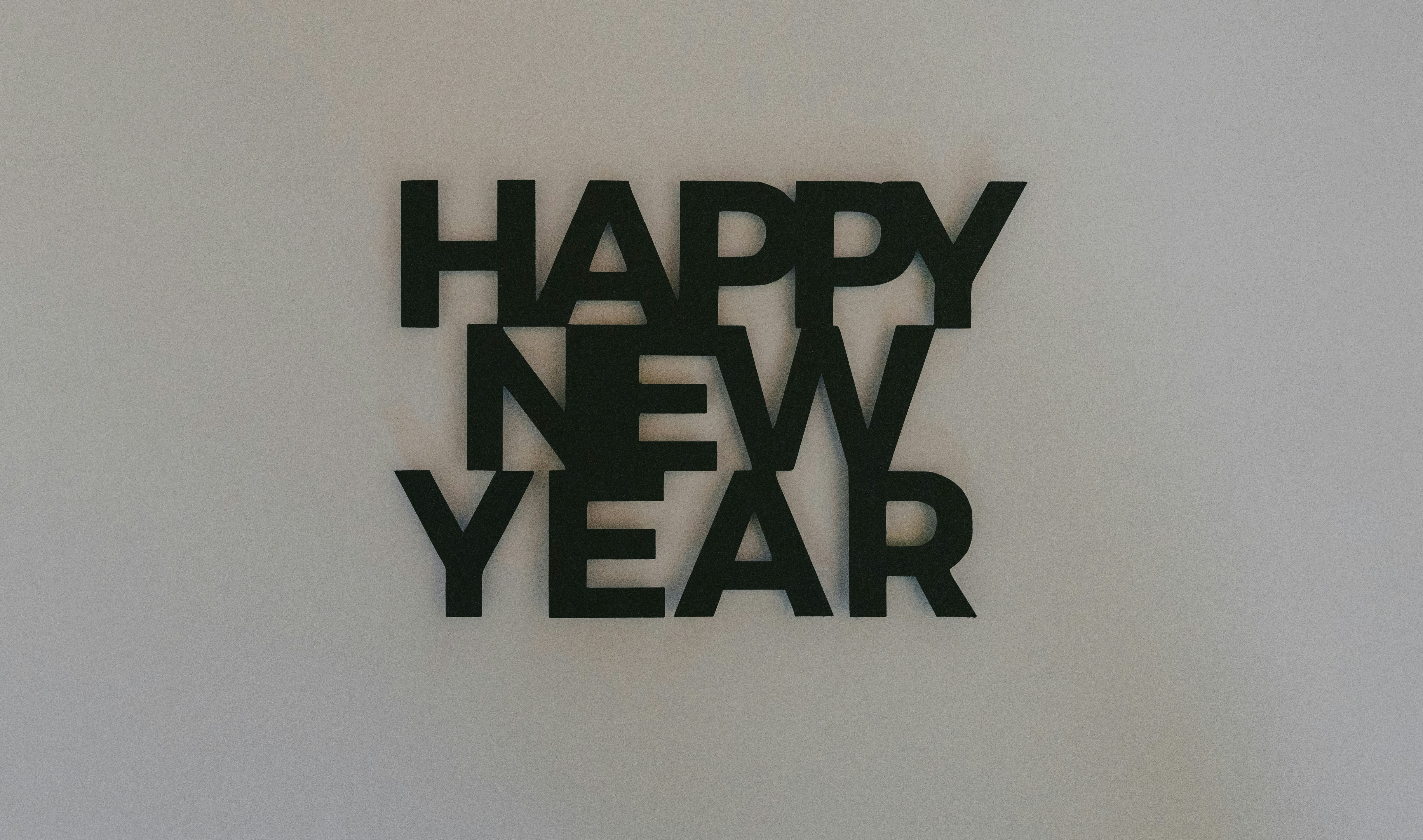 Happy New Year — Bold Typographic Greeting in Monochrome