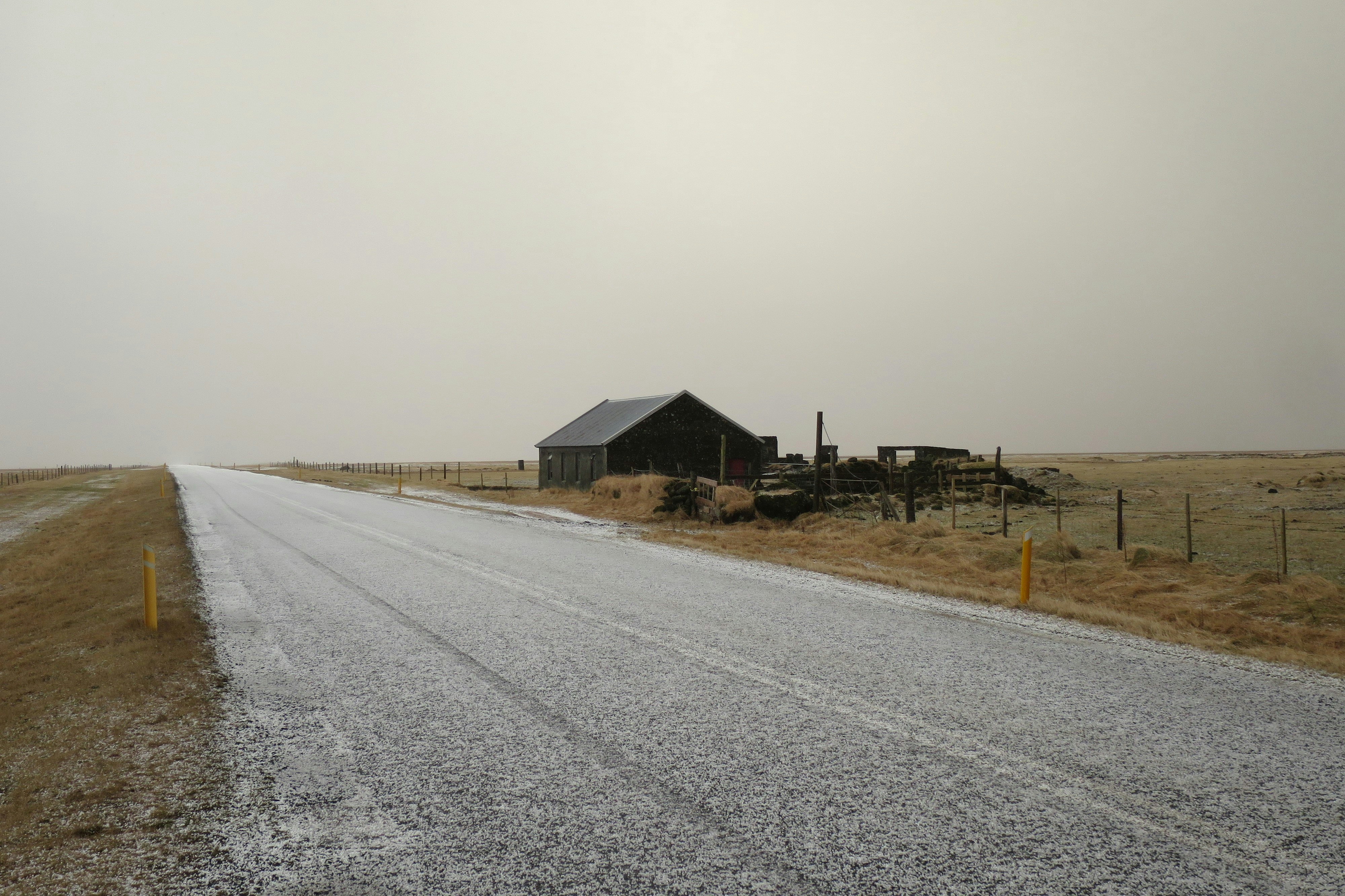 Dusty Road to an Old Barn Under a Quiet Skies