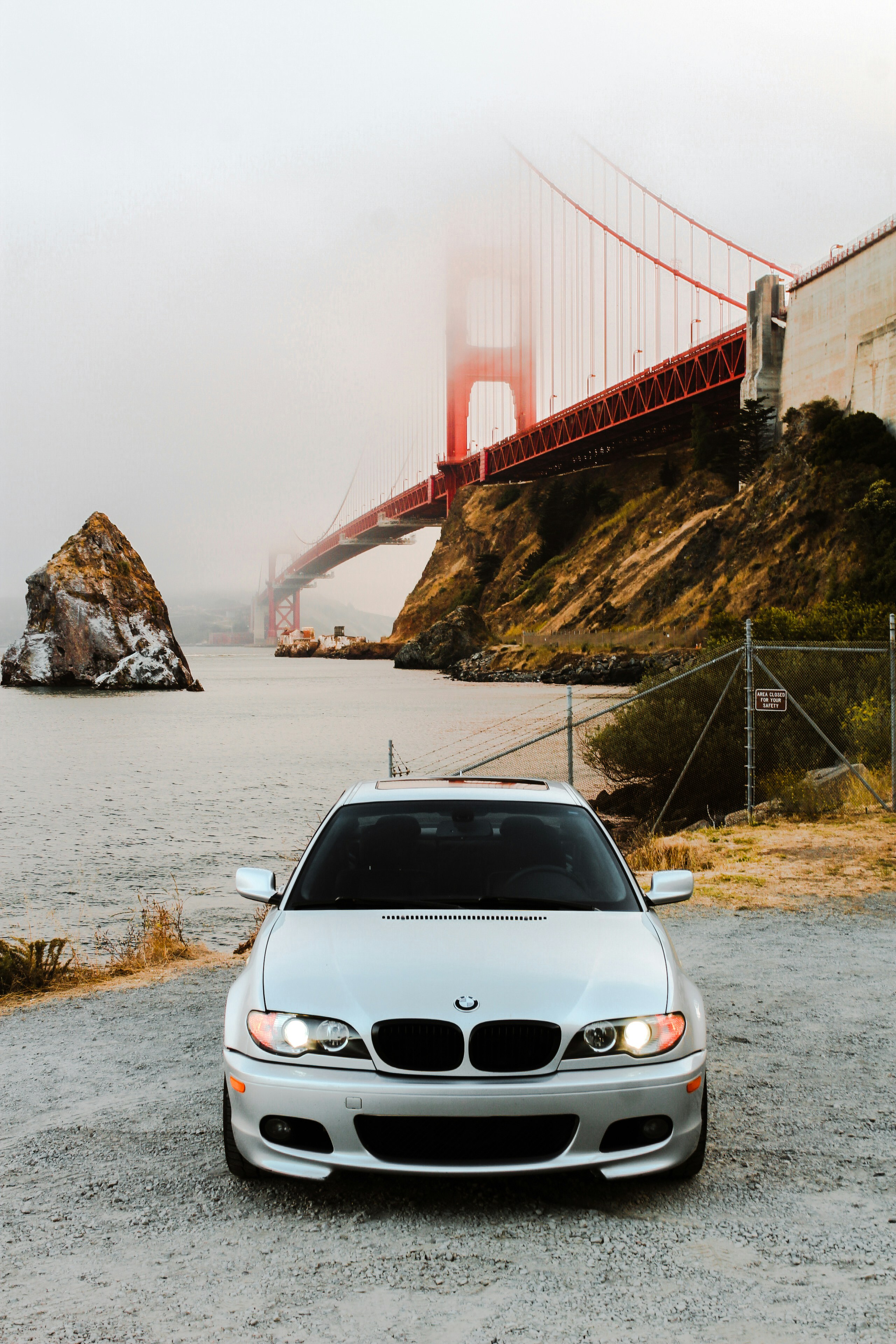White BMW Front-and-center by the Foggy Golden Gate