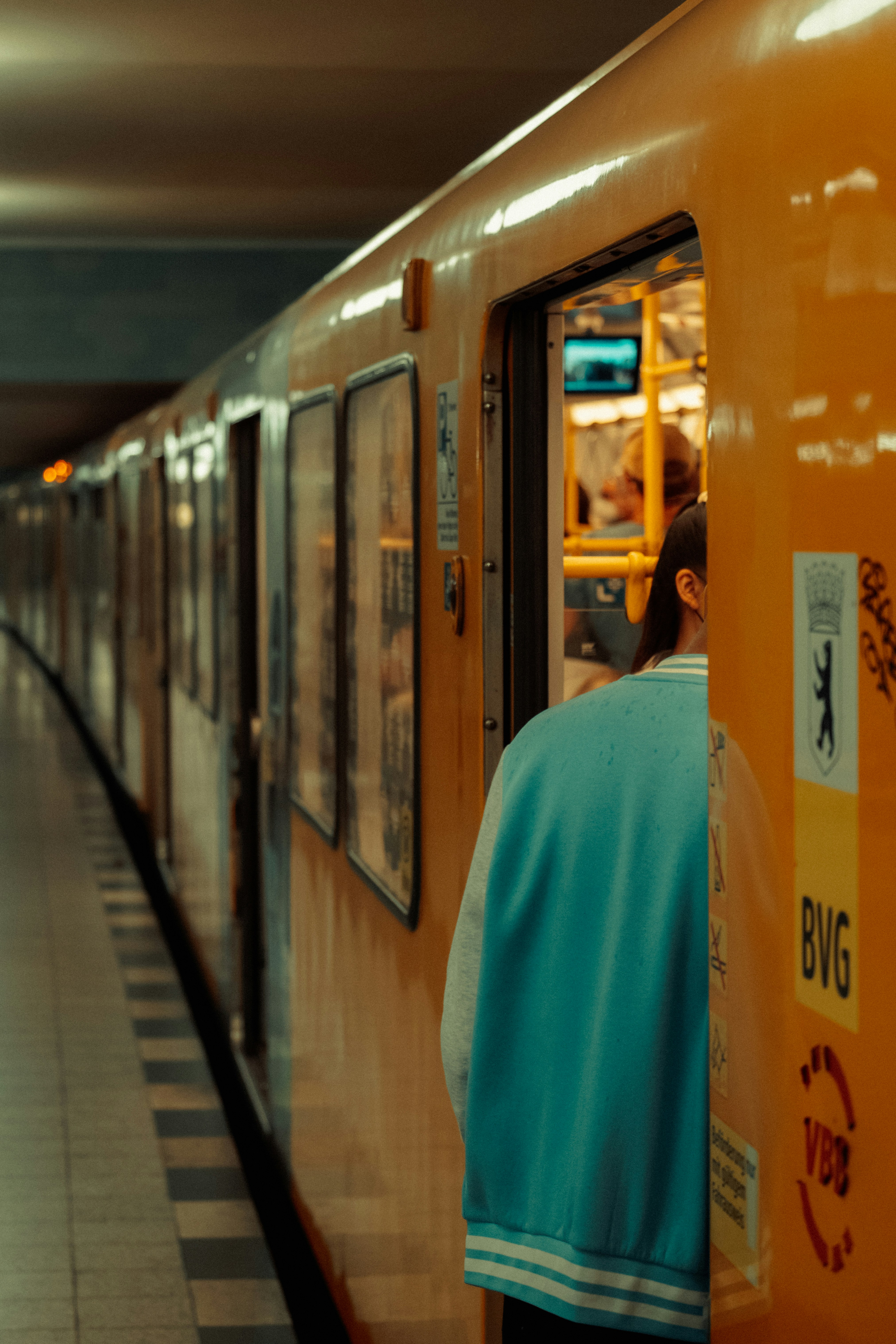 Doorstep Exit: A Blue-Jacket Moment on a Yellow Subway