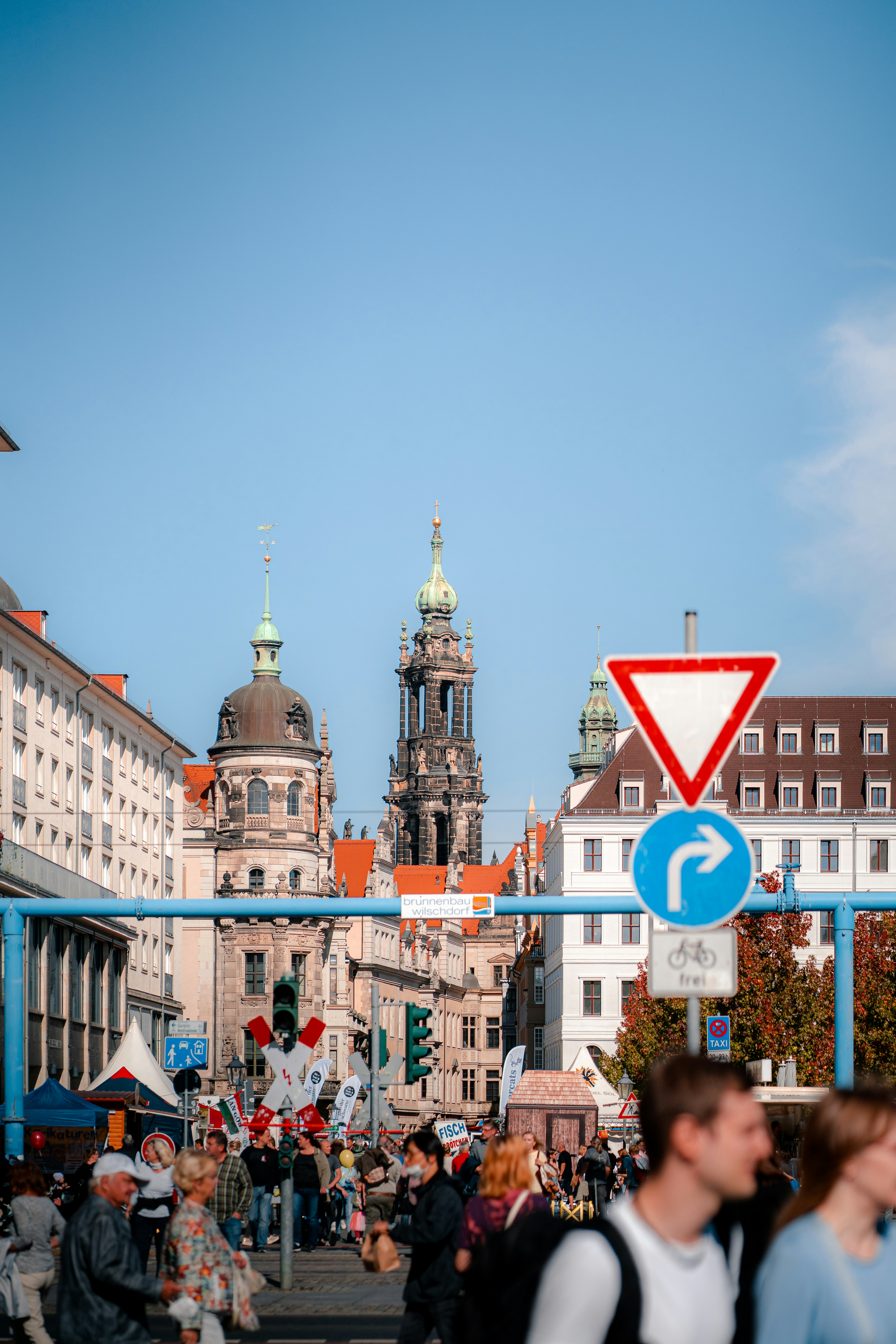 Crowned Spires Over a Bustling European Market Square