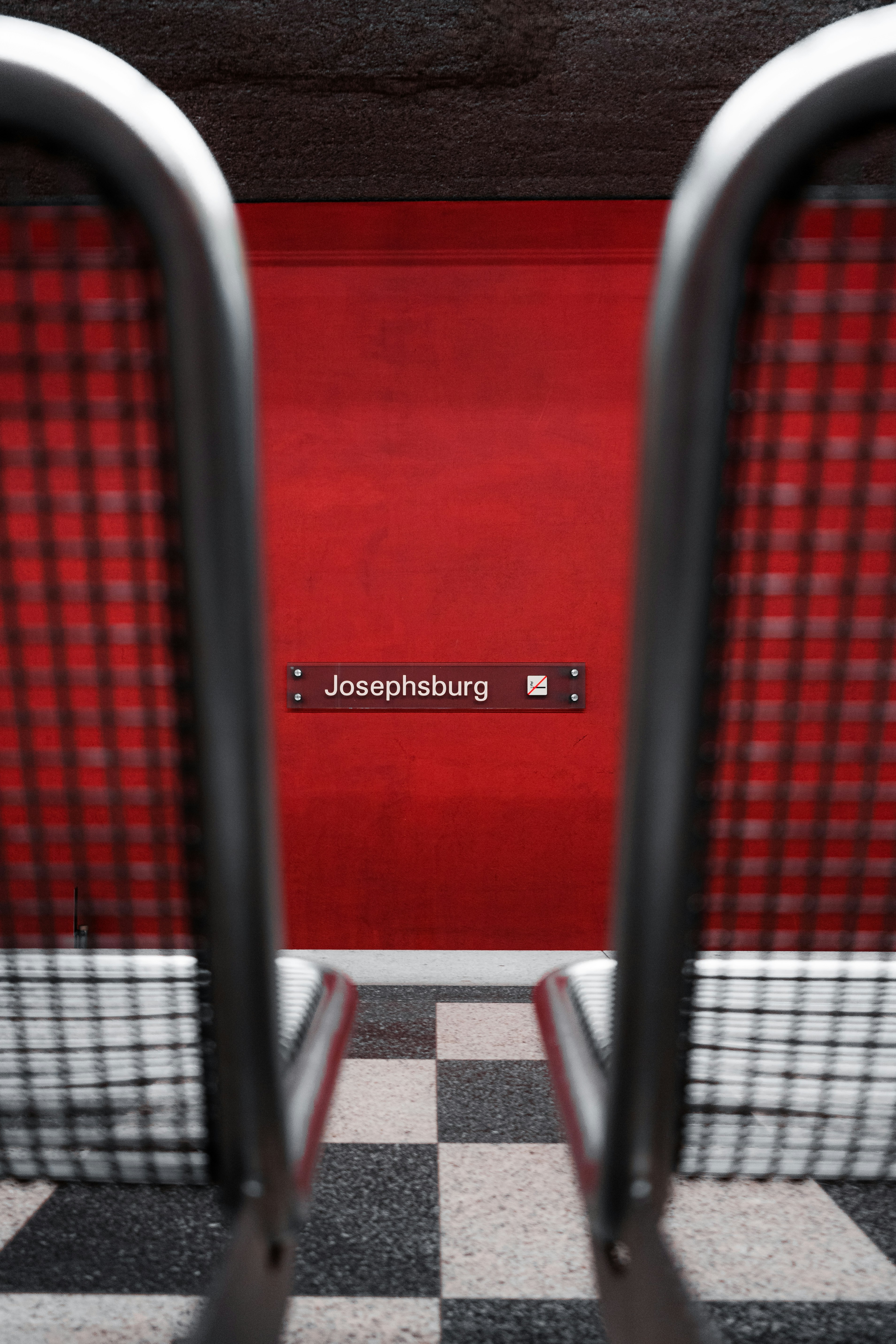 Josephsburg Stop: Red Wall Between Checkerboard Aisles