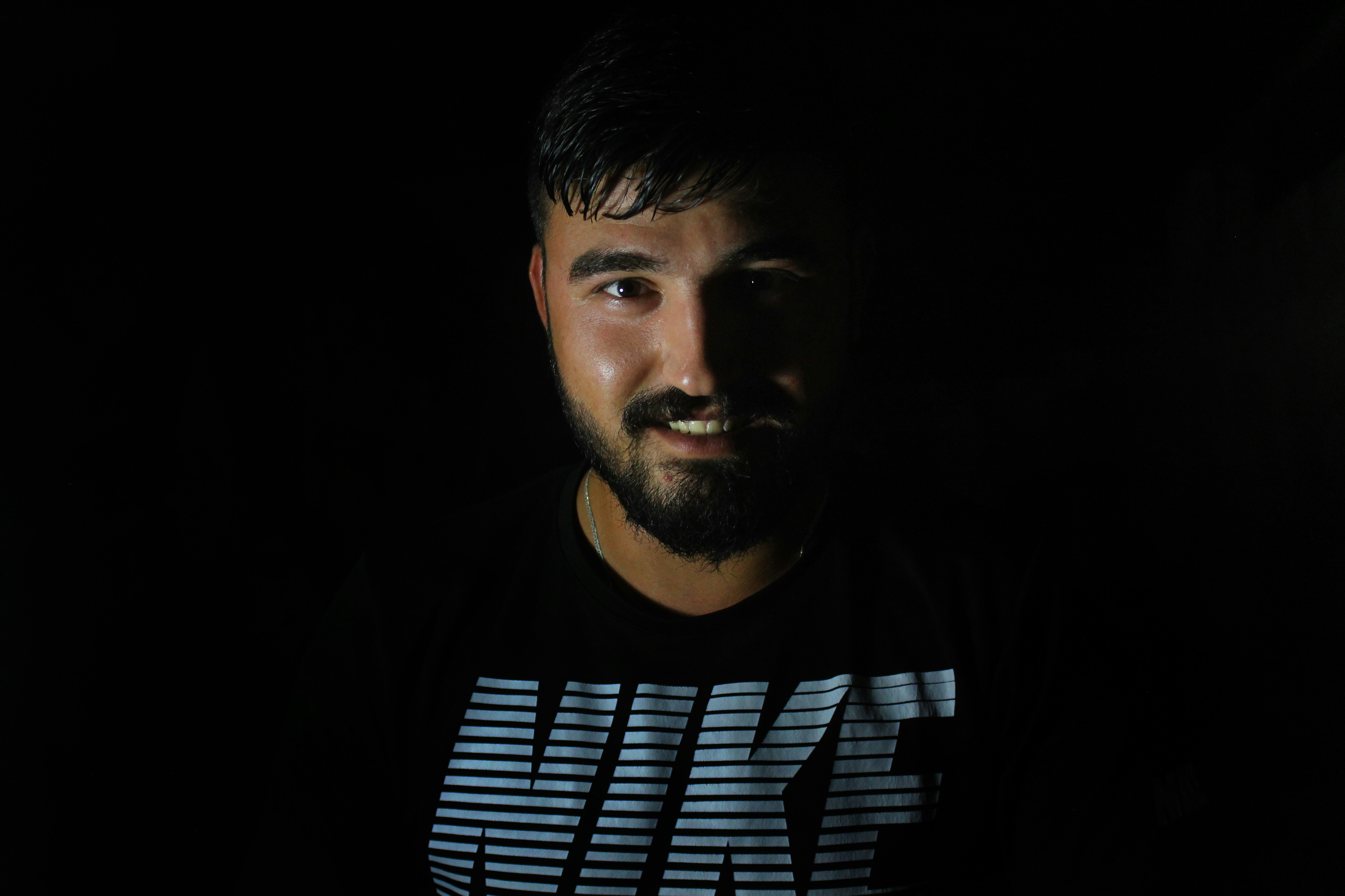 A man with a beard is smiling for the camera photo – Free Syria Image ...