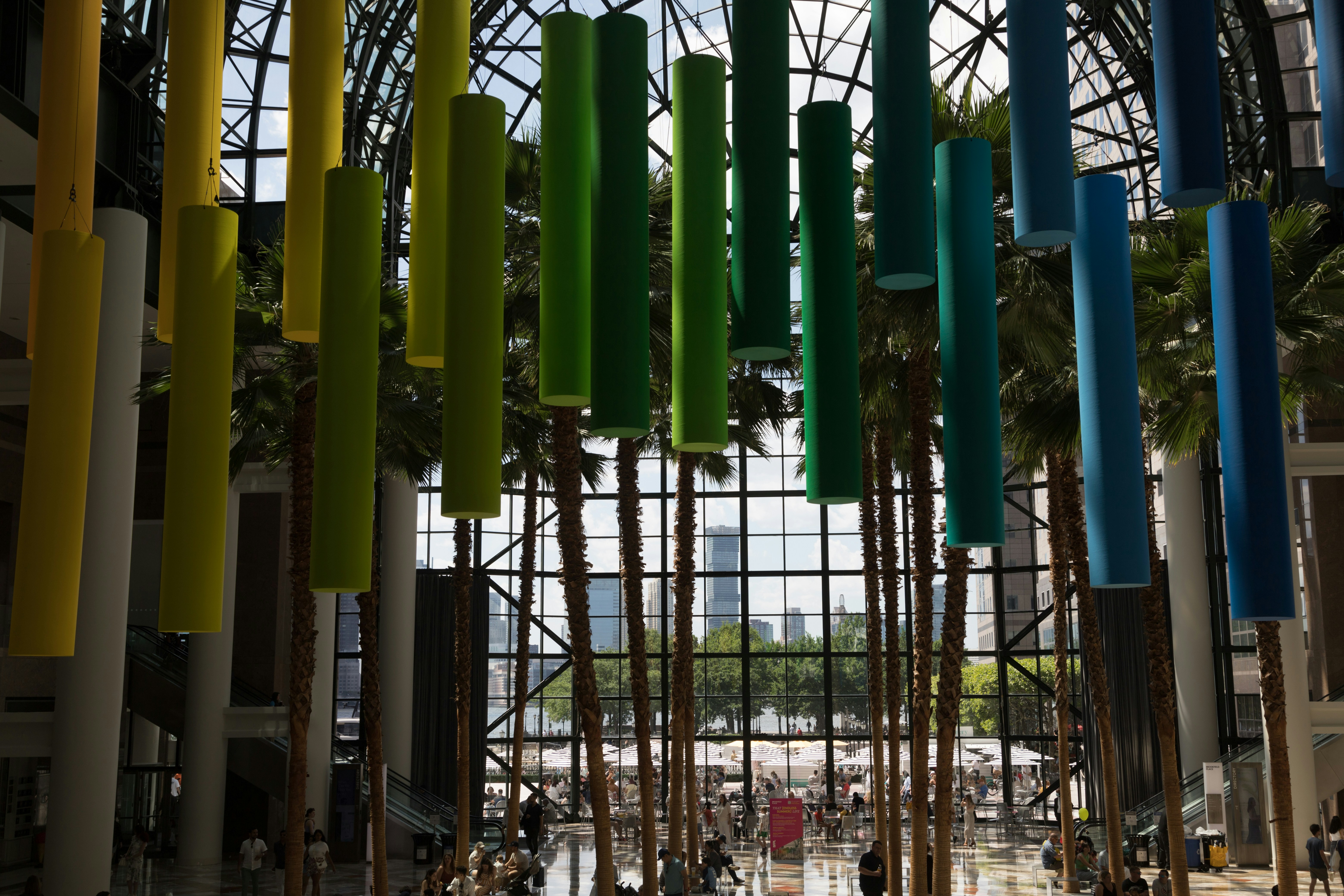 A large building with a bunch of colorful objects hanging from it's ...