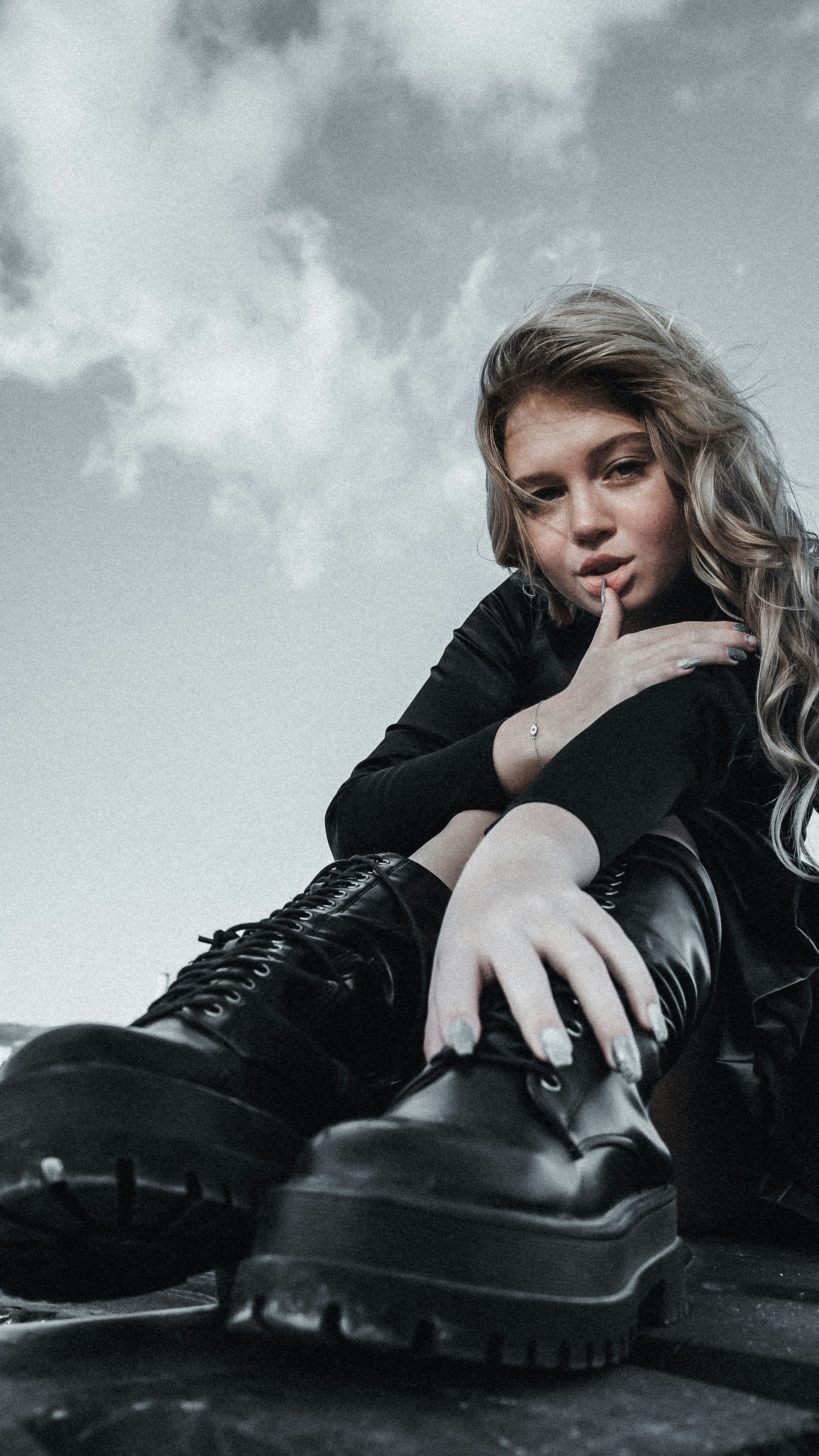 Gaze from the Ground: A Bold Low-Angle Portrait in Black Leather