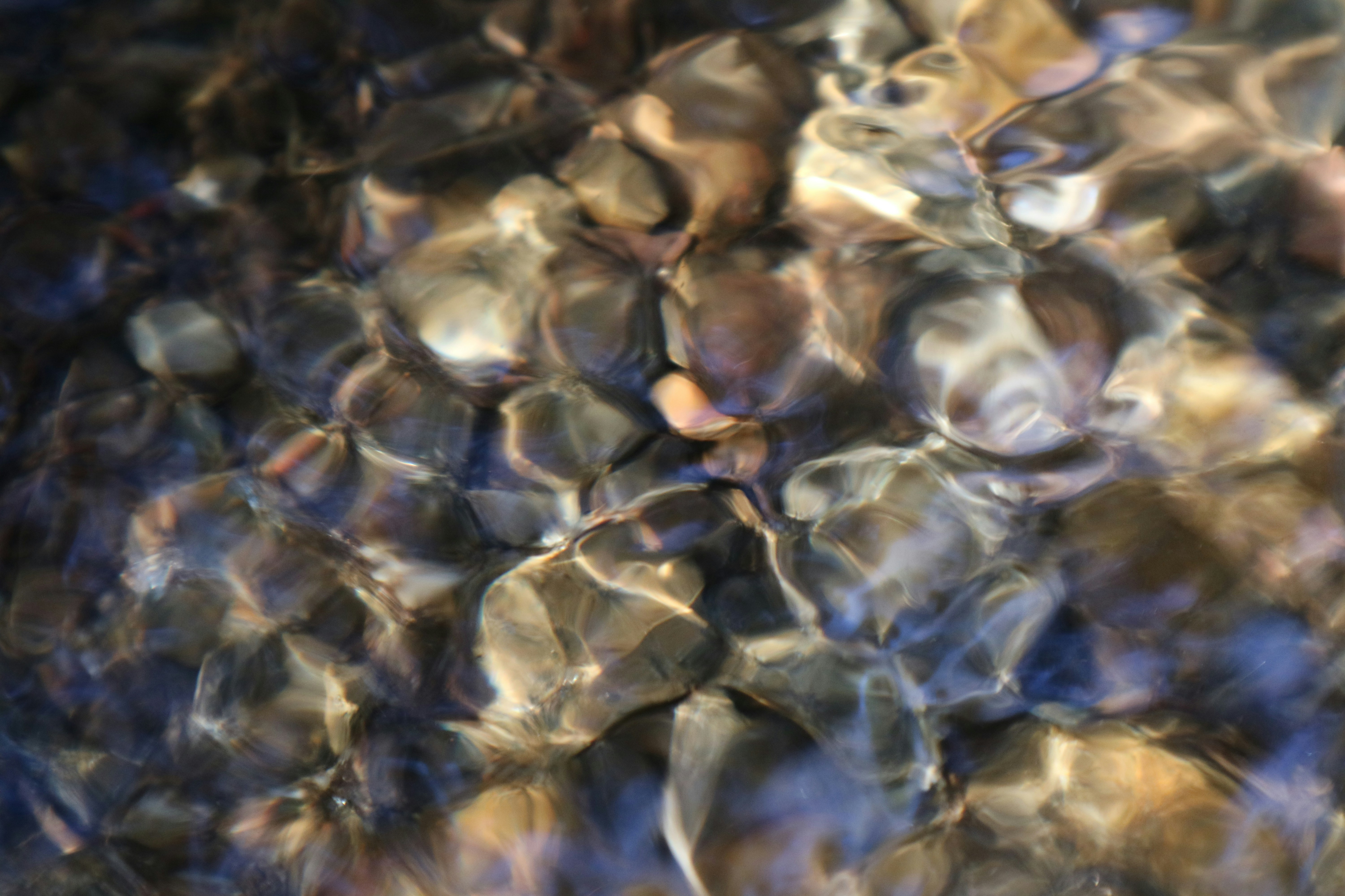 A blurry photo of rocks and water photo – Free Spring Image on Unsplash
