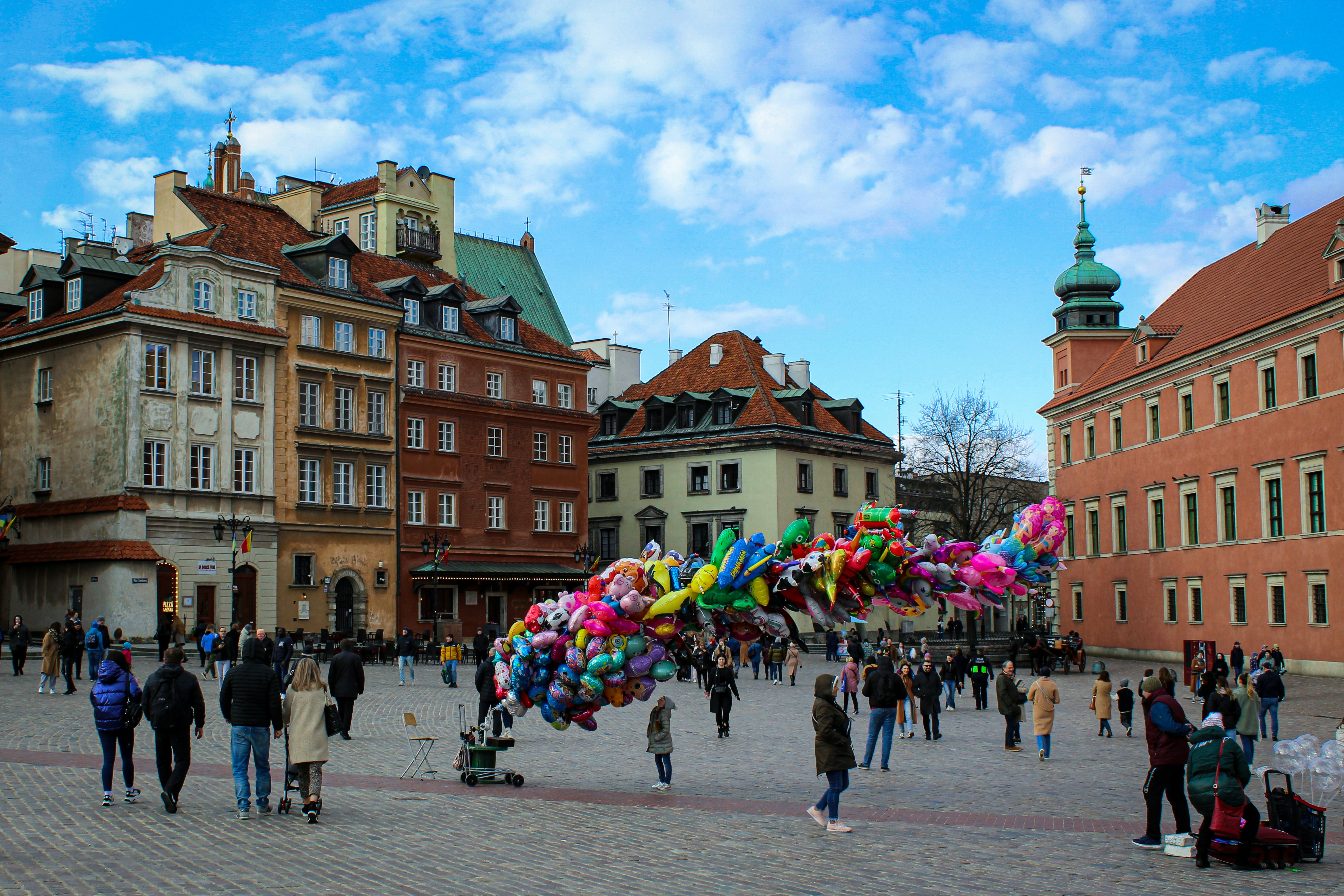 Balloon Cascade Over a Cobblestoned City Square