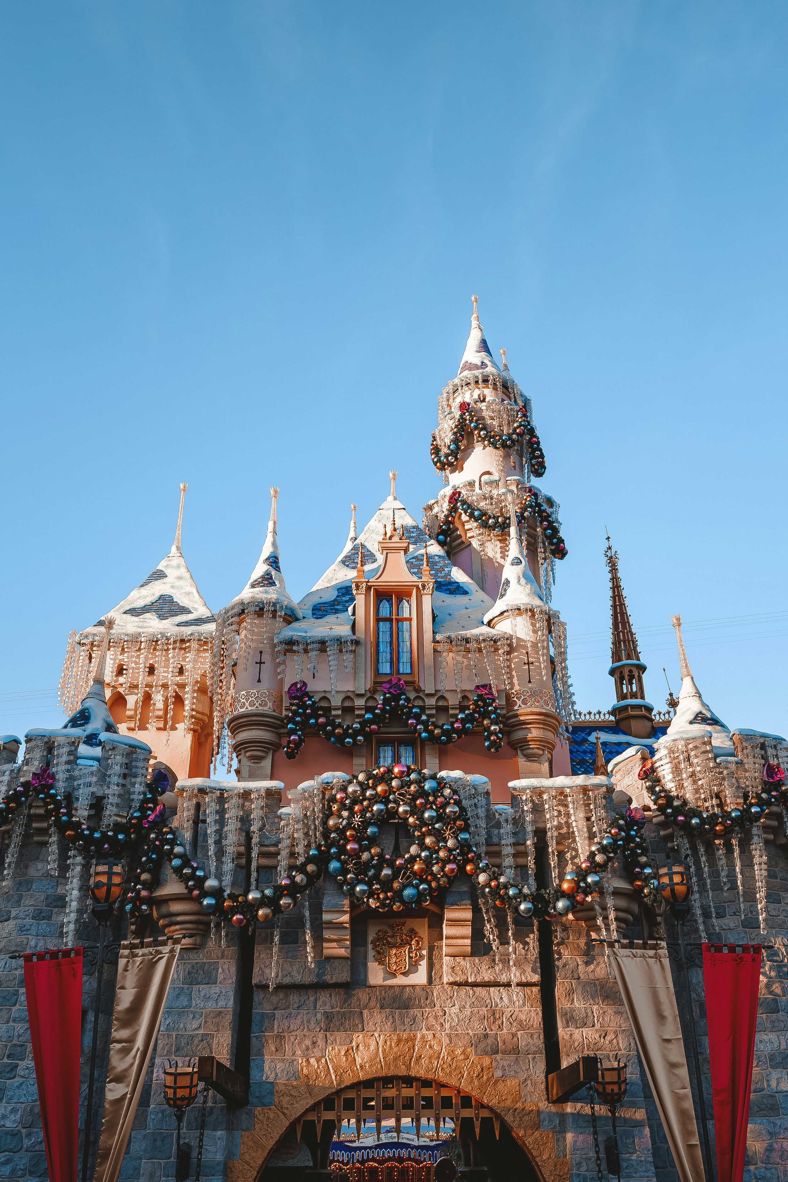 Fairy tale castle decorated with colorful ornaments and snow, capturing the essence of a magical winter celebration.
