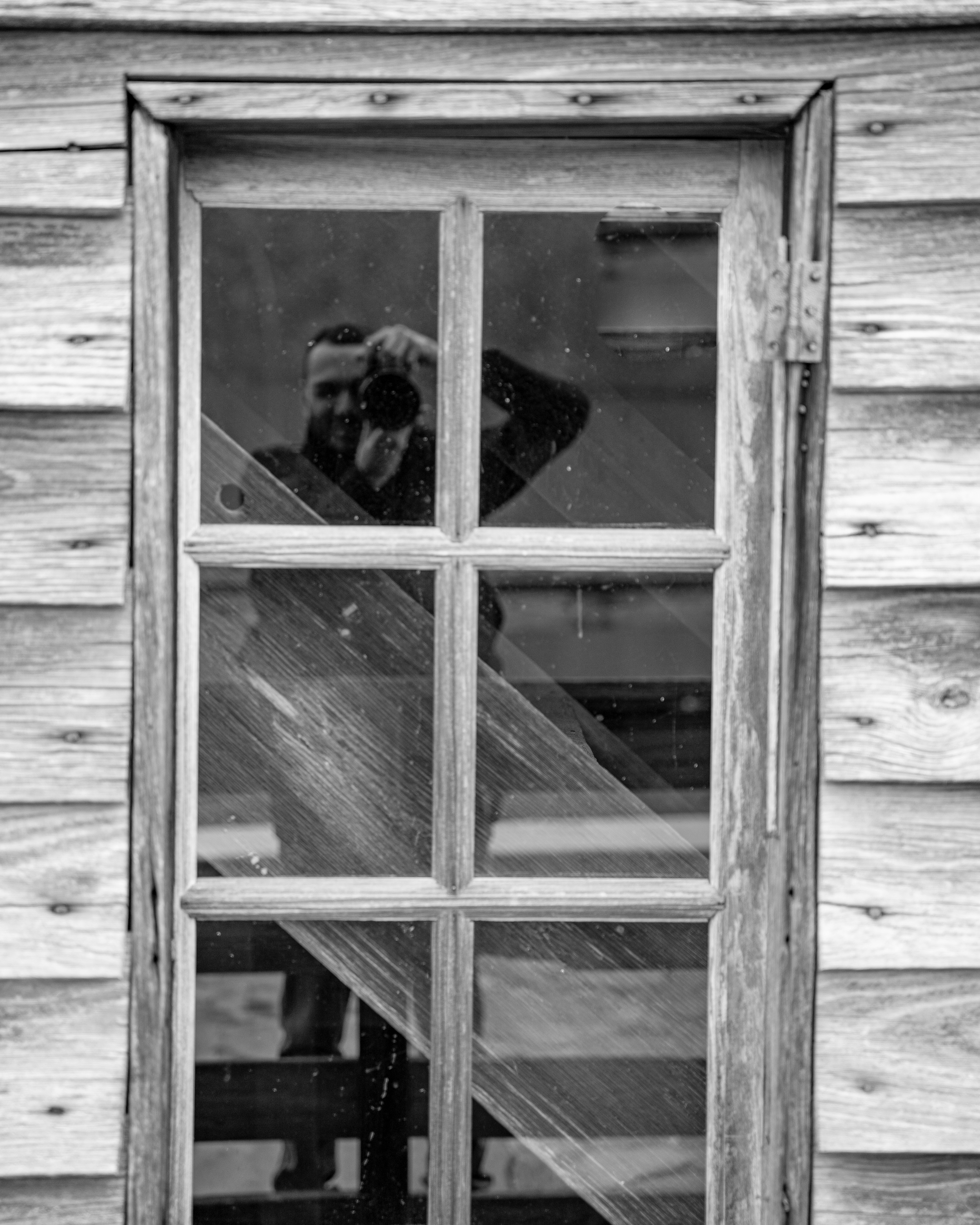 A person taking a picture through a window photo – Free Usa Image on ...